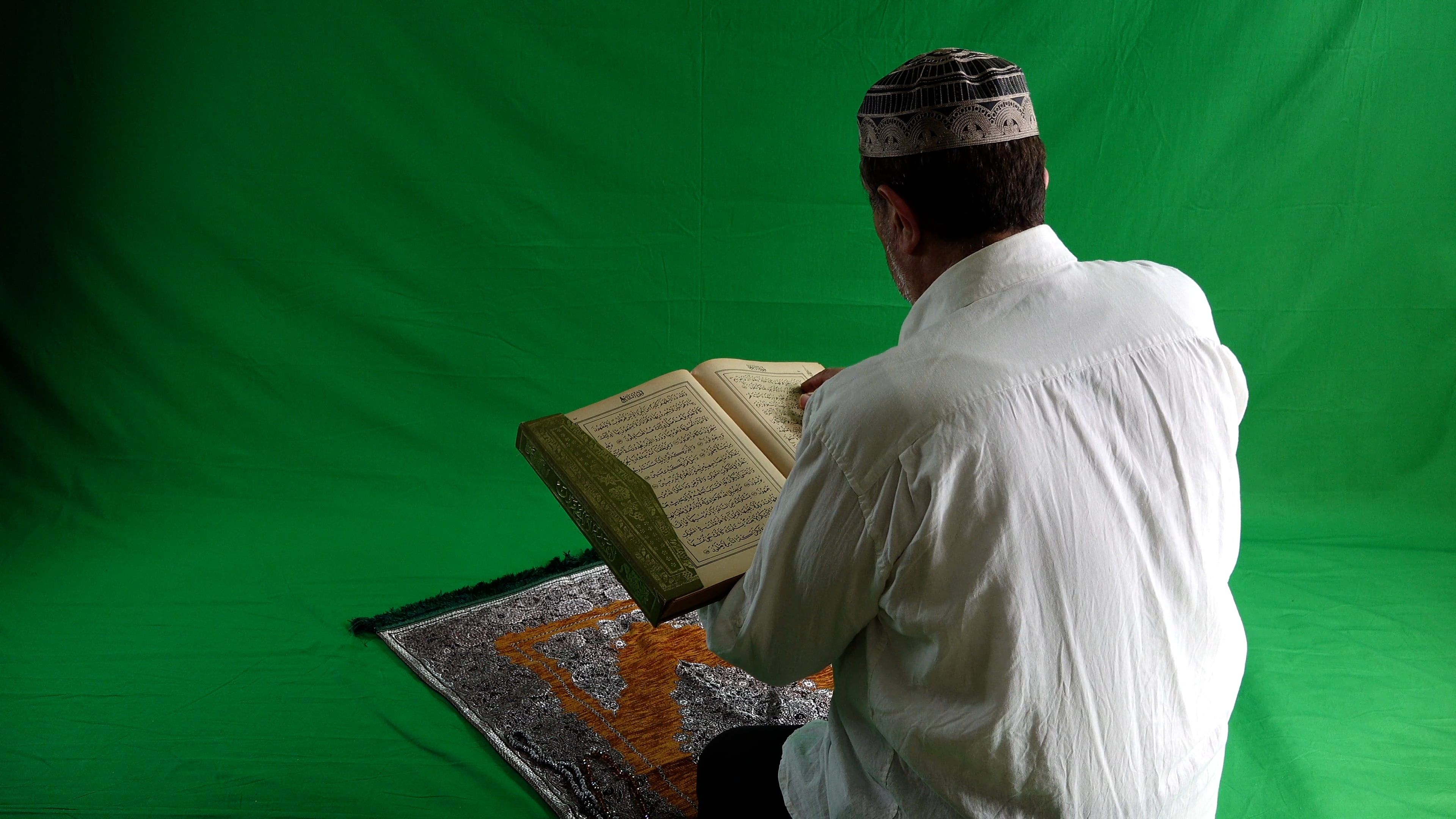 Man Reading Koran Against Green Screen Free Stock Video Footage ...