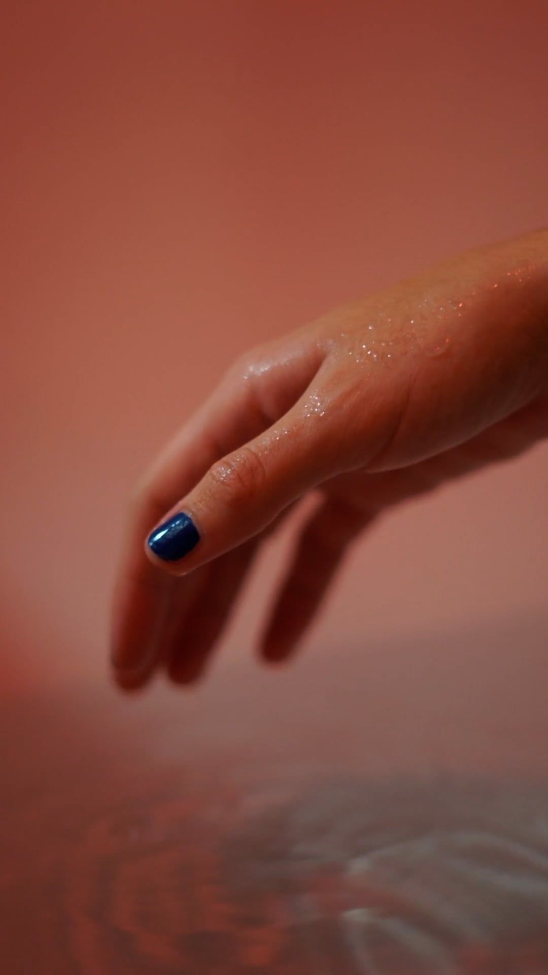 Female Hand Dipping into Water in Bathtub · Free Stock Video