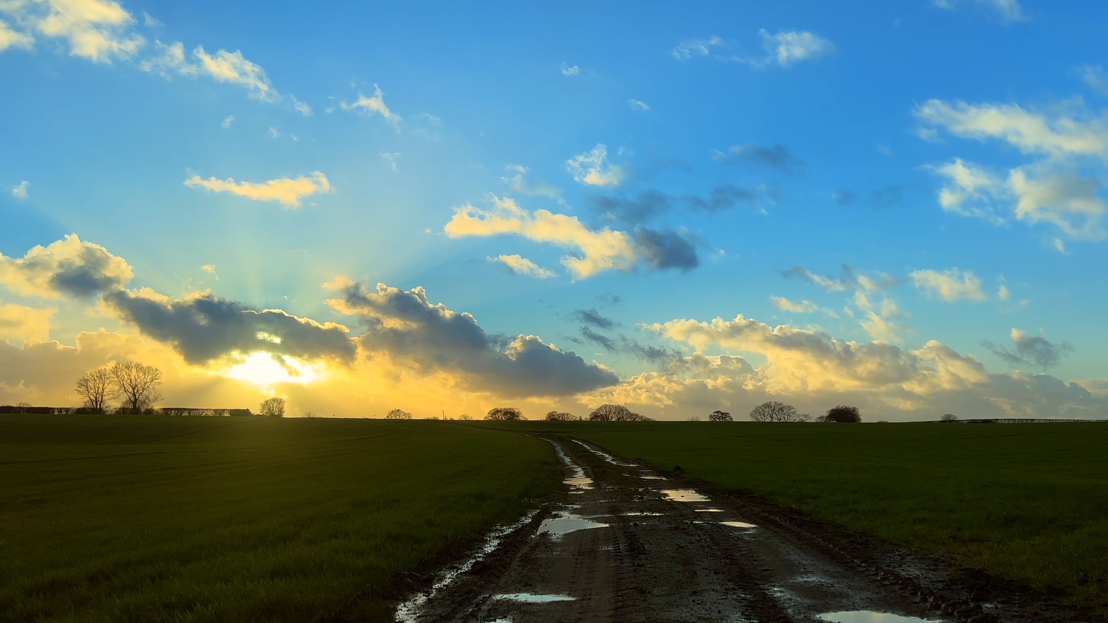 Time Lapse of Sunlight and Clouds over Ground Road on Plains · Free ...