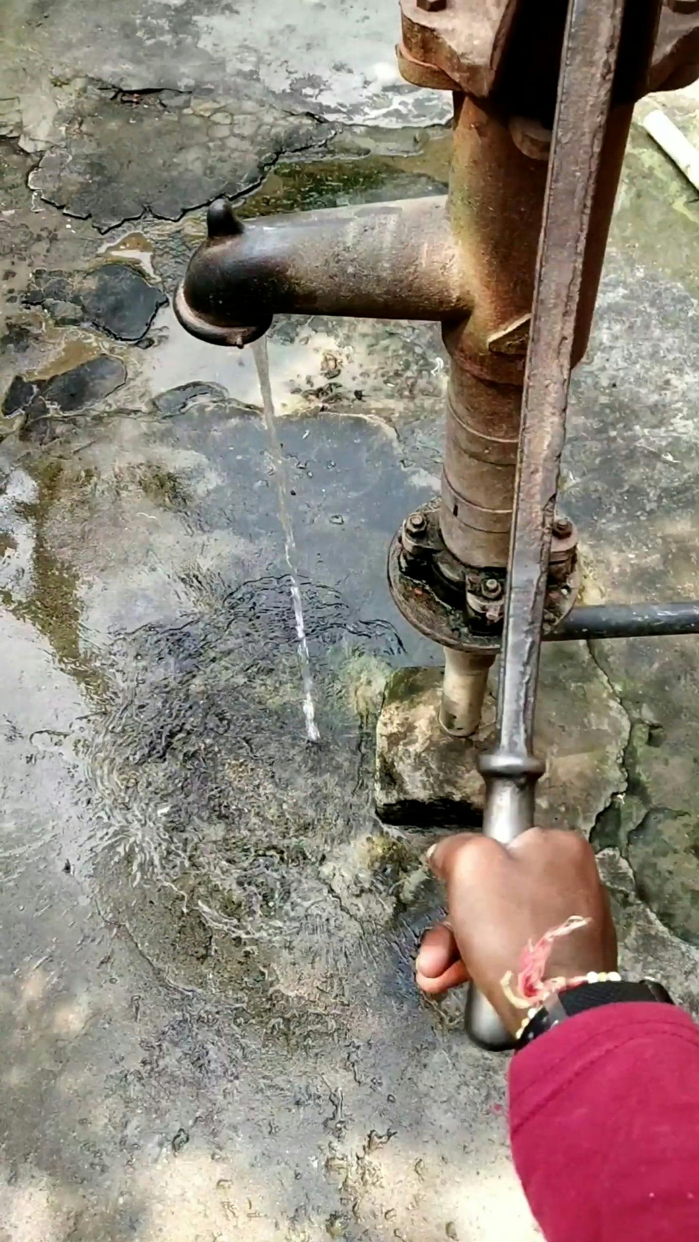Water from Hand Pump · Free Stock Video