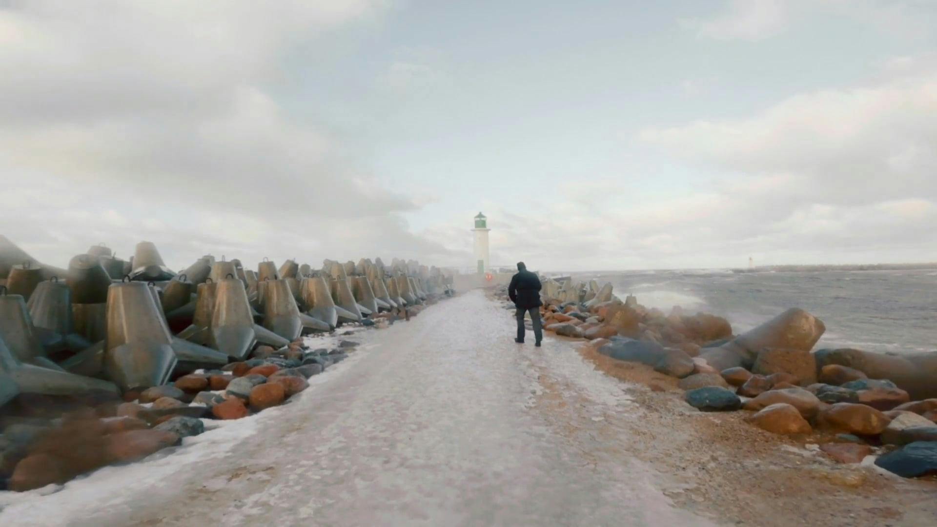 Back View of a Man Walking towards a Lighthouse Free Stock Video ...