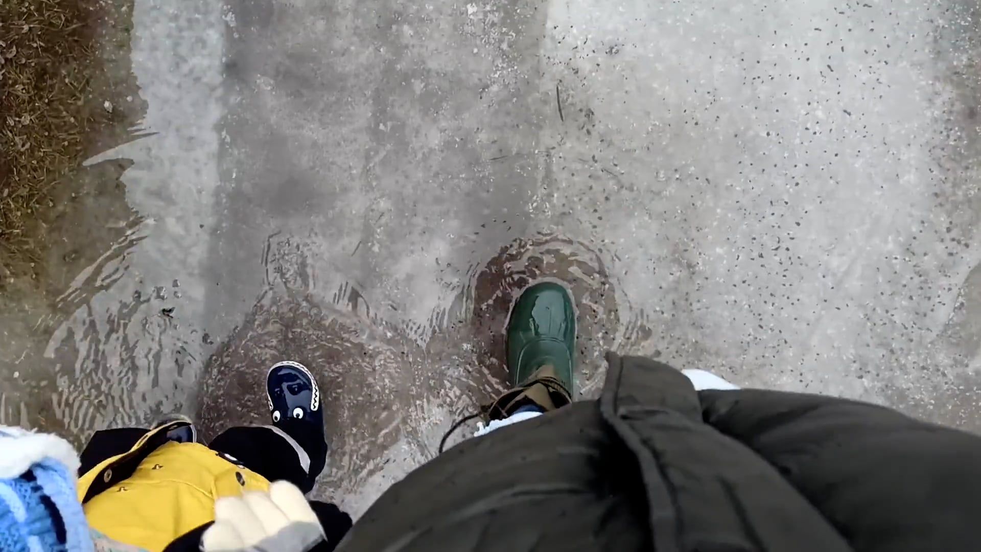 A Person Wearing Waterproof Boots Stomping Rain Water Residue on The ...