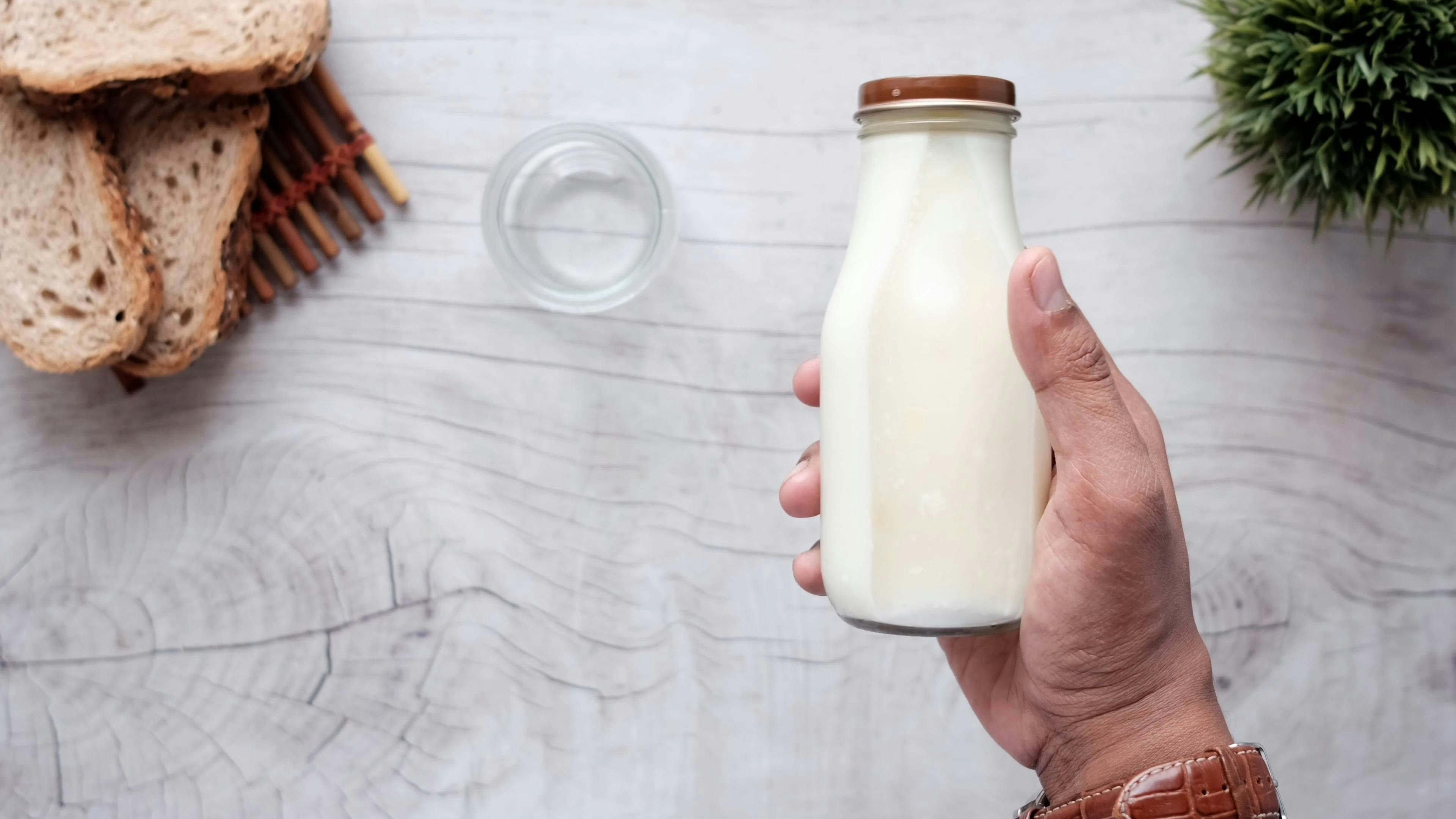 Hand Holding Milk Free Stock Video Footage, Royalty-Free 4K & HD Video Clip