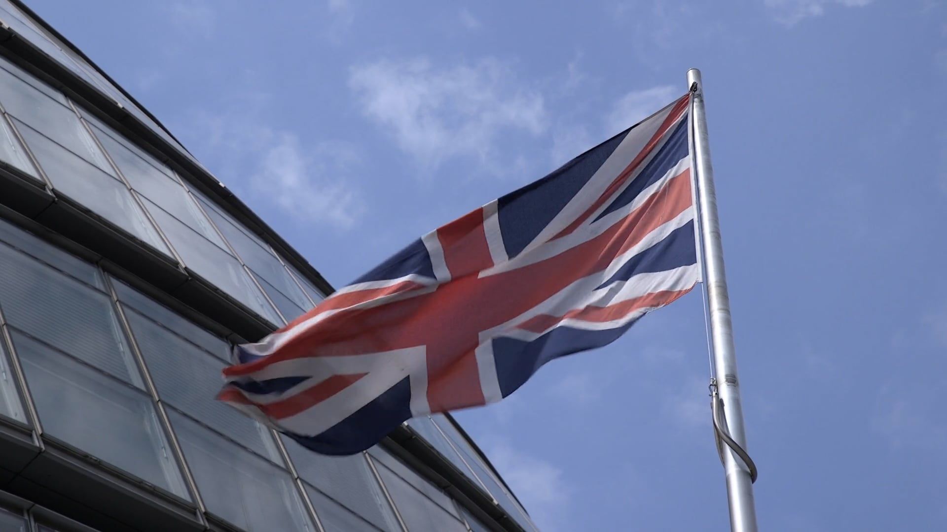 The United Kingdom Flag Waving on a Pole Free Stock Video Footage ...