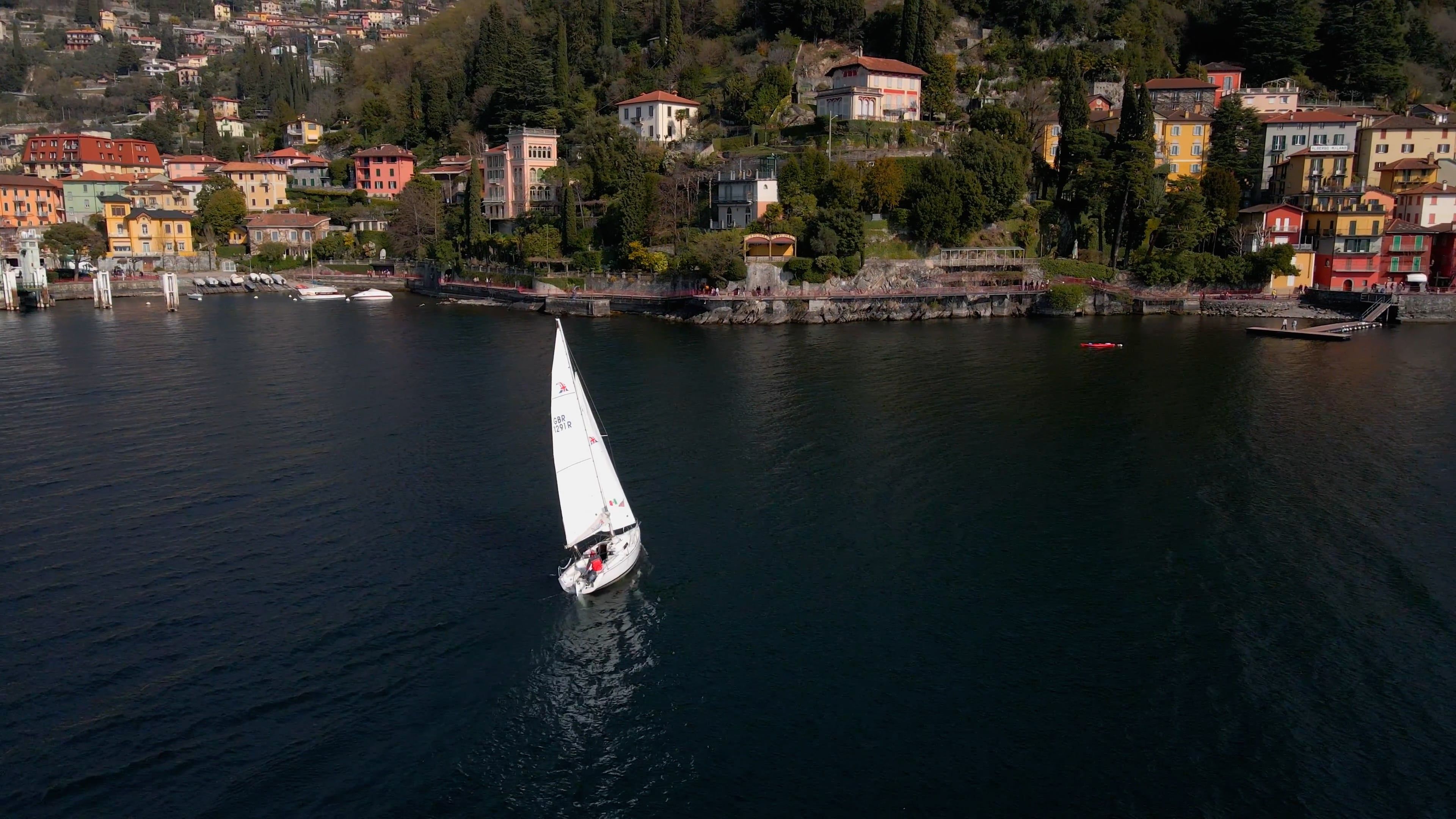 A Boat Sailing in Lake Como near Varenna Village Free Stock Video ...