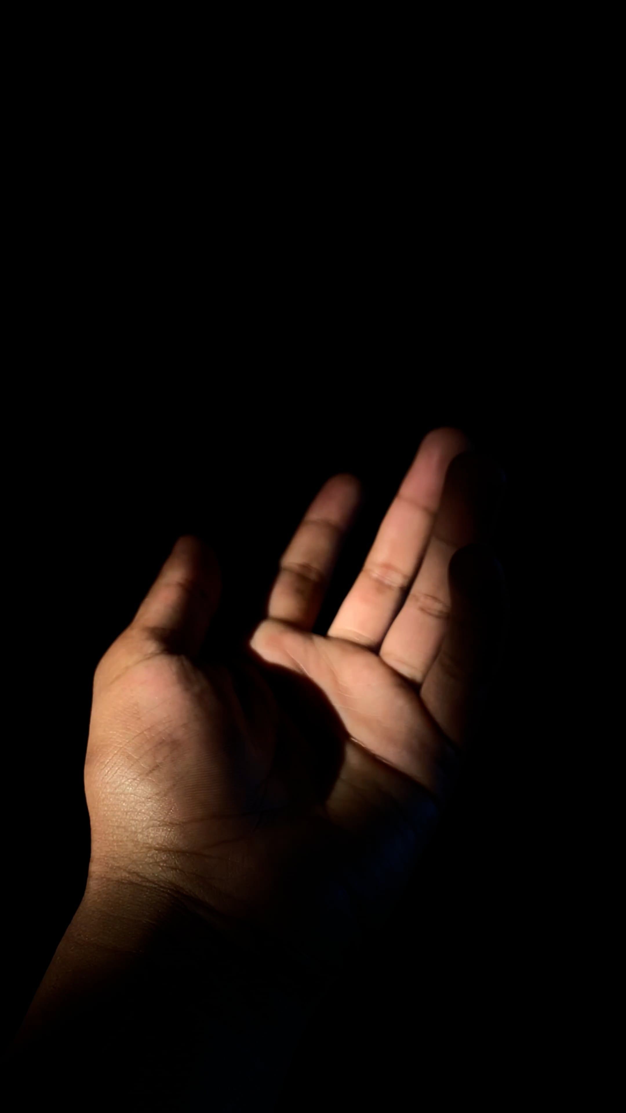 Hand in Shadow and Light · Free Stock Video