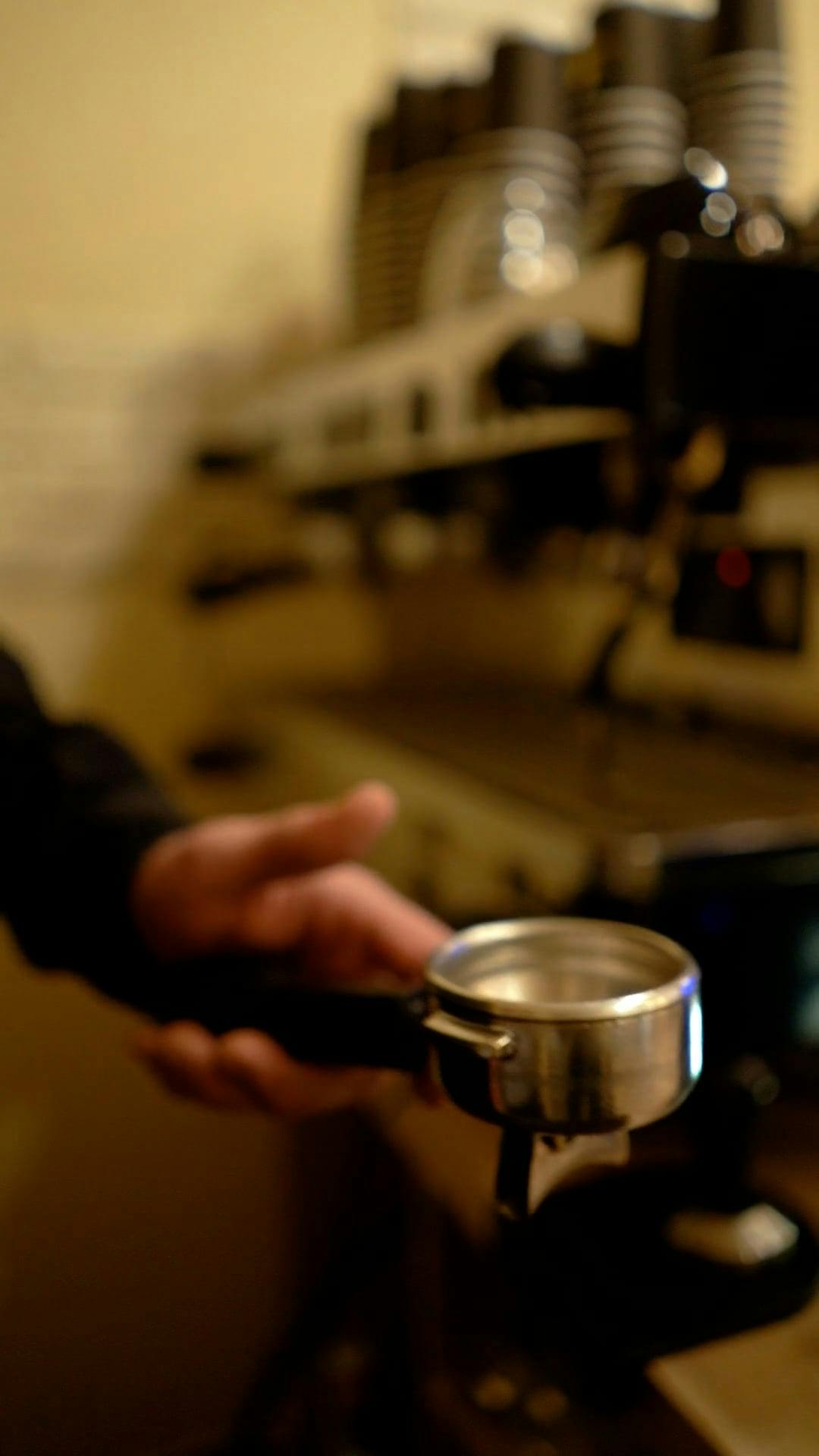 A Person Filling an Espresso Machine Portafilter with Ground Coffee ...