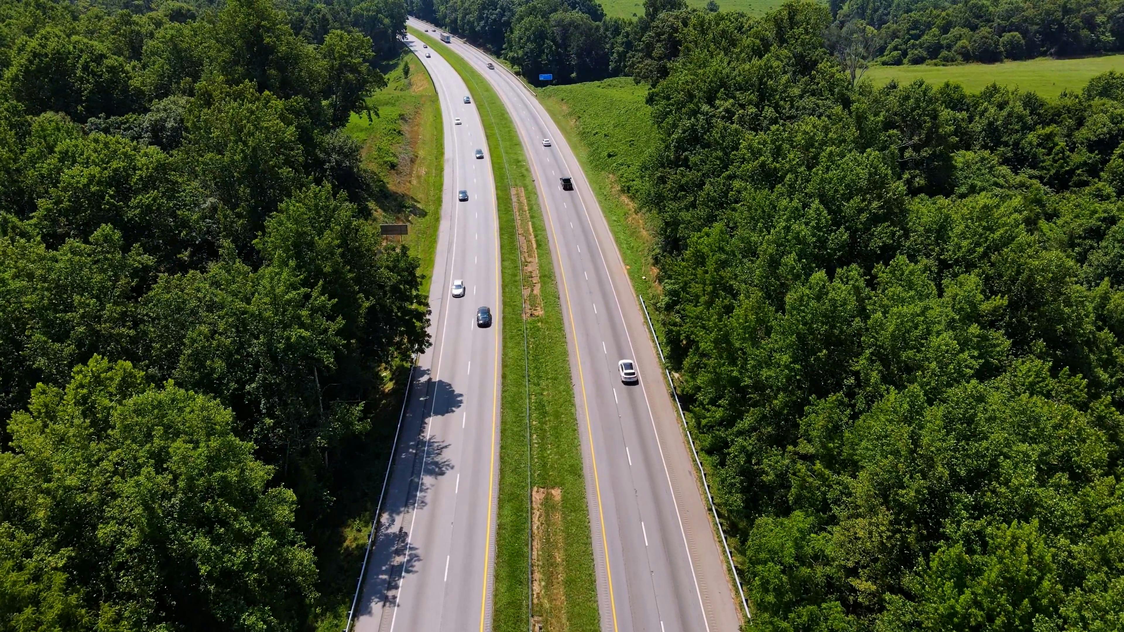 Drone Video of Vehicles Driving on an Interstate Highway · Free Stock Video