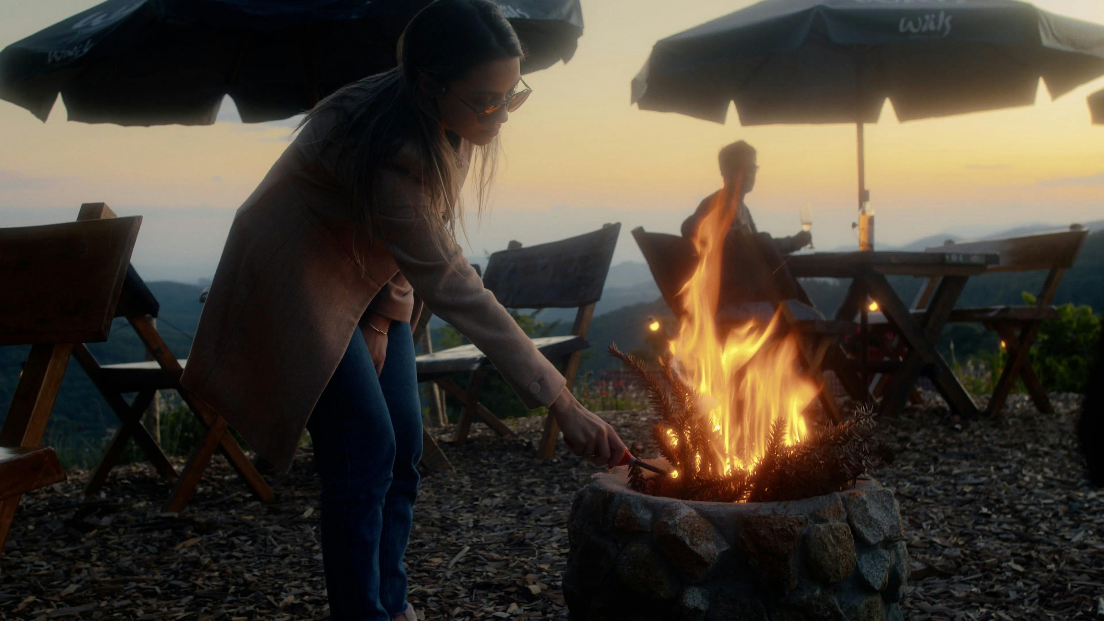 A Woman Lighting a Fire Pit at an Outdoor Bar Free Stock Video Footage ...