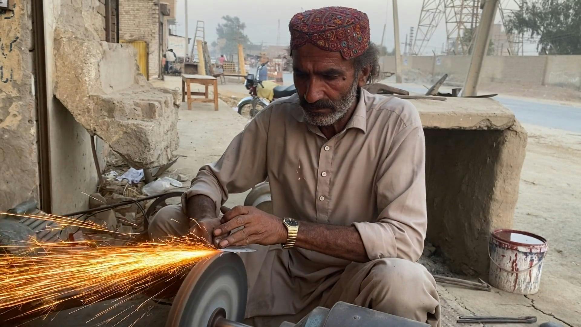 A Man Working with a Grinding Wheel in the Street Free Stock Video ...