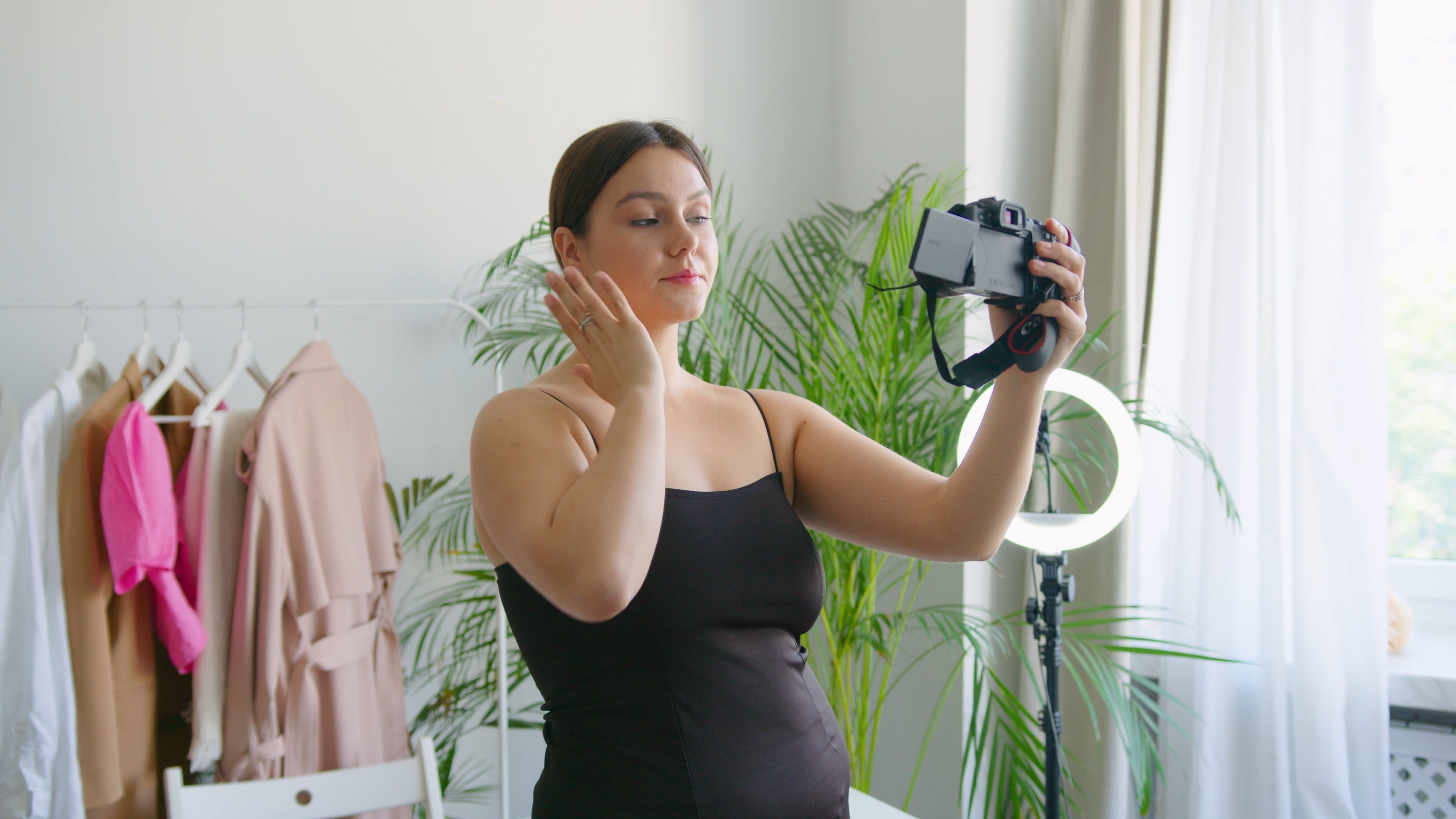 A Woman using a Video Camera while Doing a Vlog Free Stock Video ...