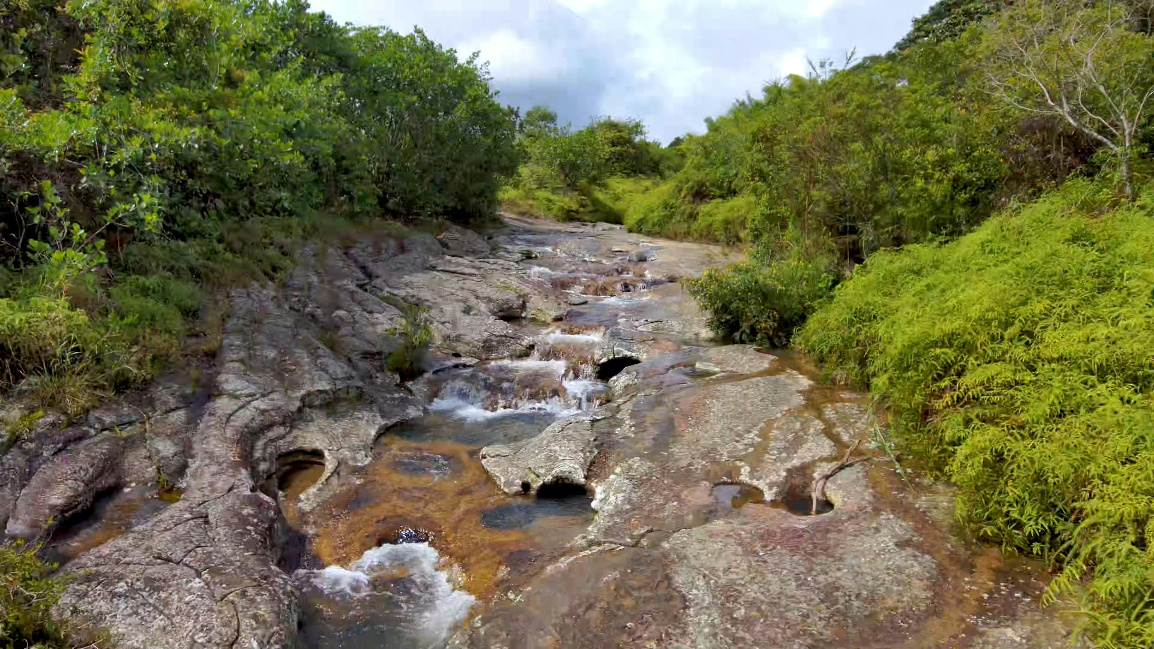 Drone Shot of a Stream and a Waterfall in a Natural Setting Free Stock ...