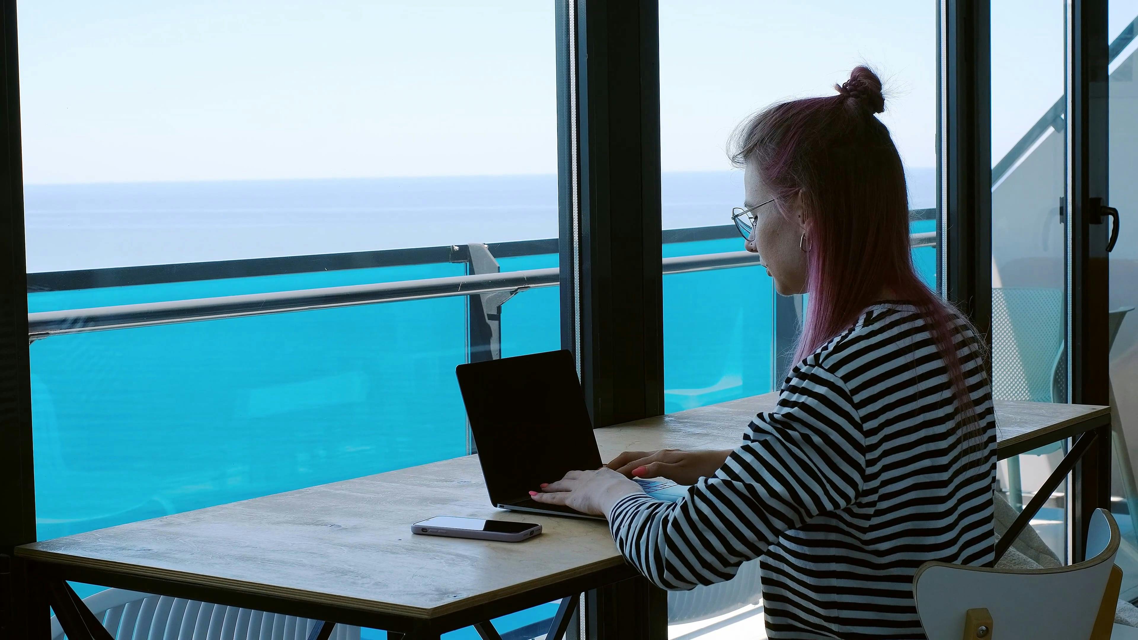 A Person Using a Laptop Computer while Travelling on a Train Free Stock ...