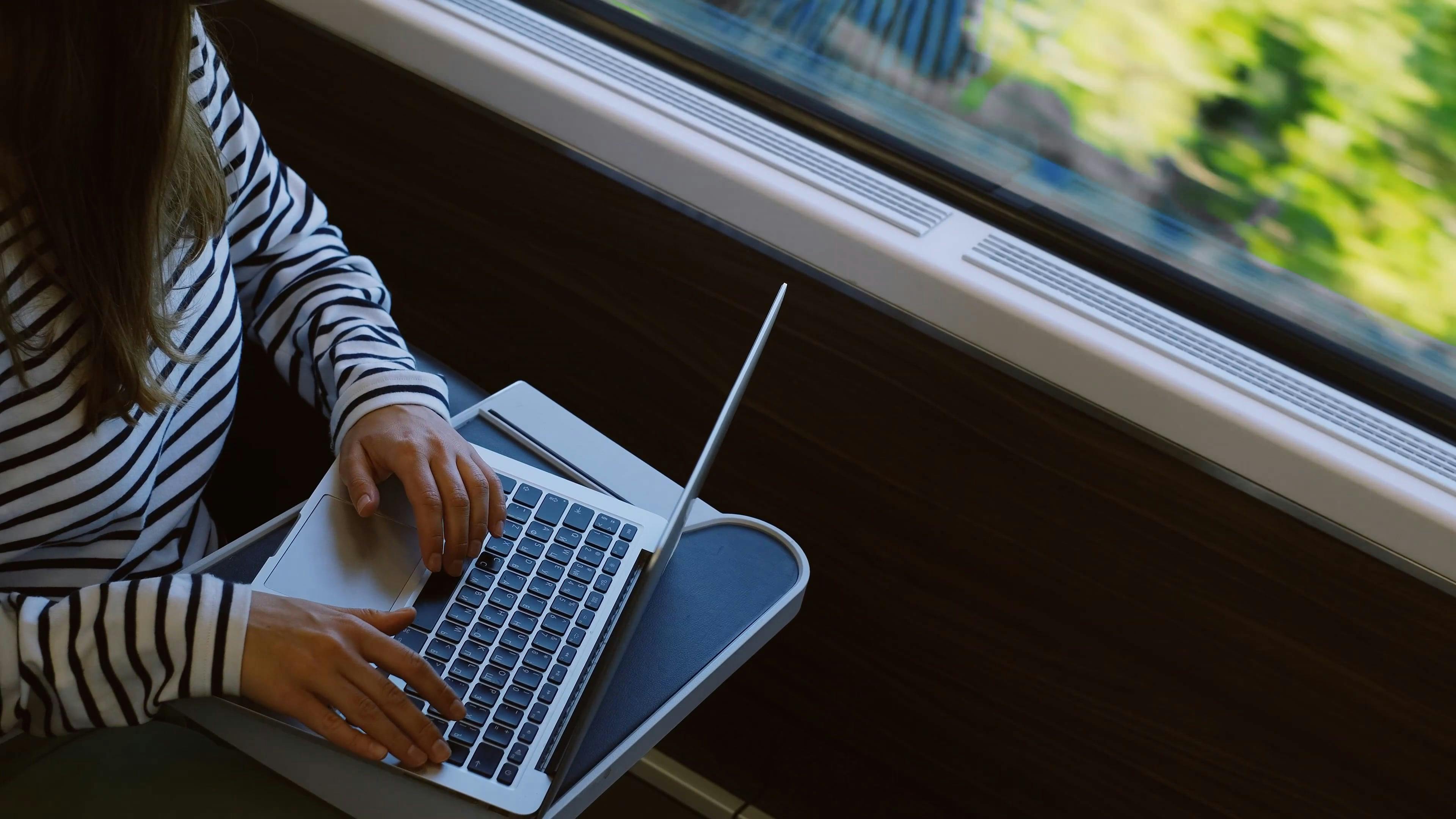 A Woman using a Laptop while Riding a Train Free Stock Video Footage ...