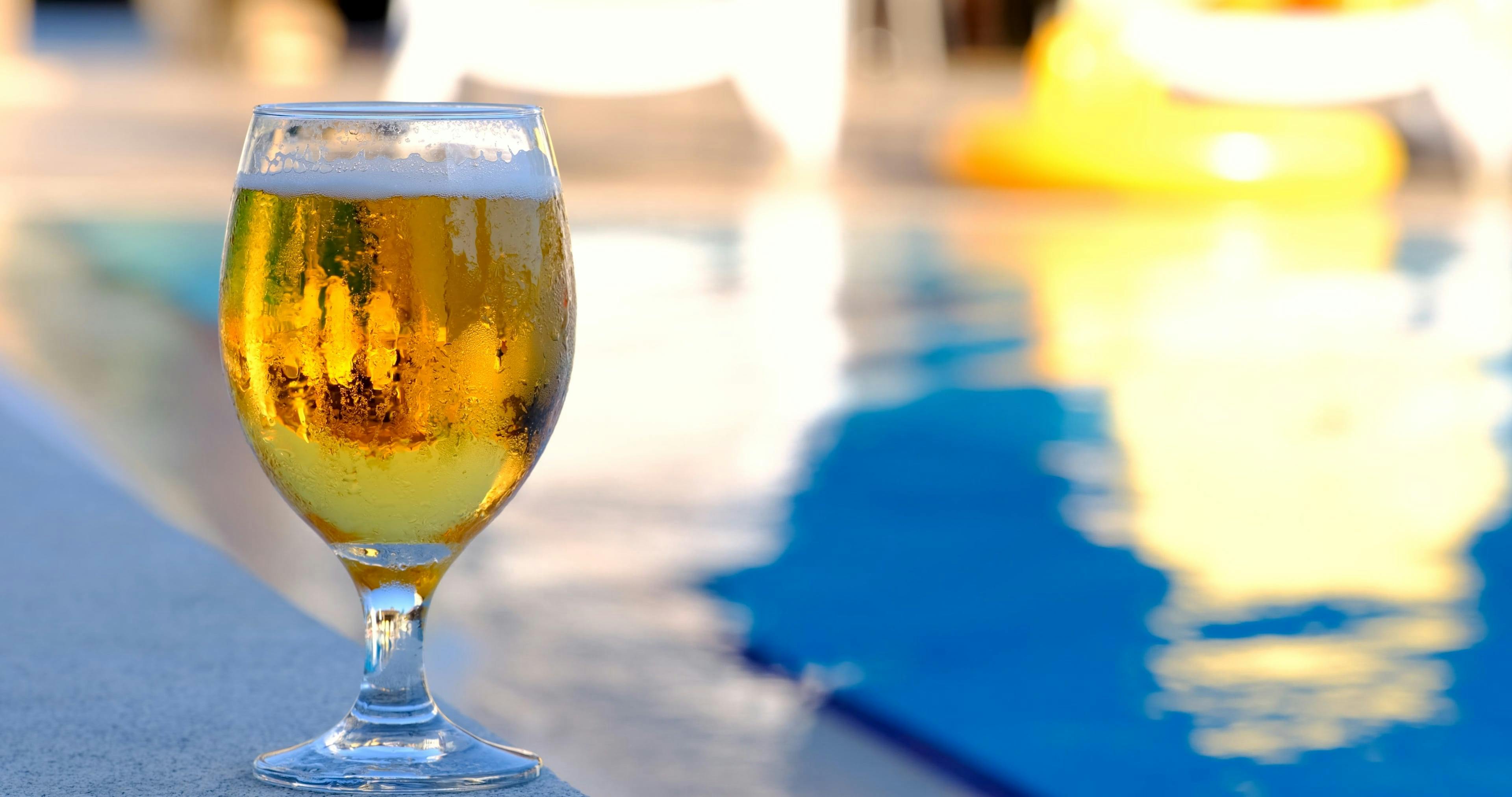 A Glass of Beer by the Swimming Pool Free Stock Video Footage, Royalty ...