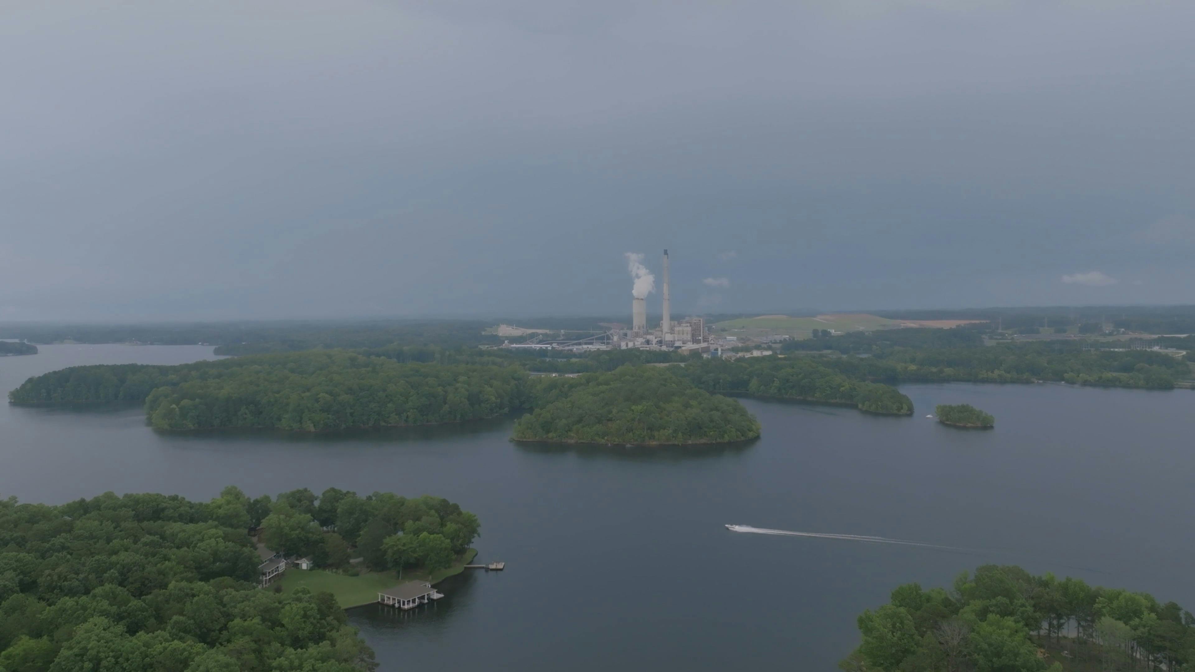 Drone Shot of a Lake with a Distant Factory Free Stock Video Footage ...