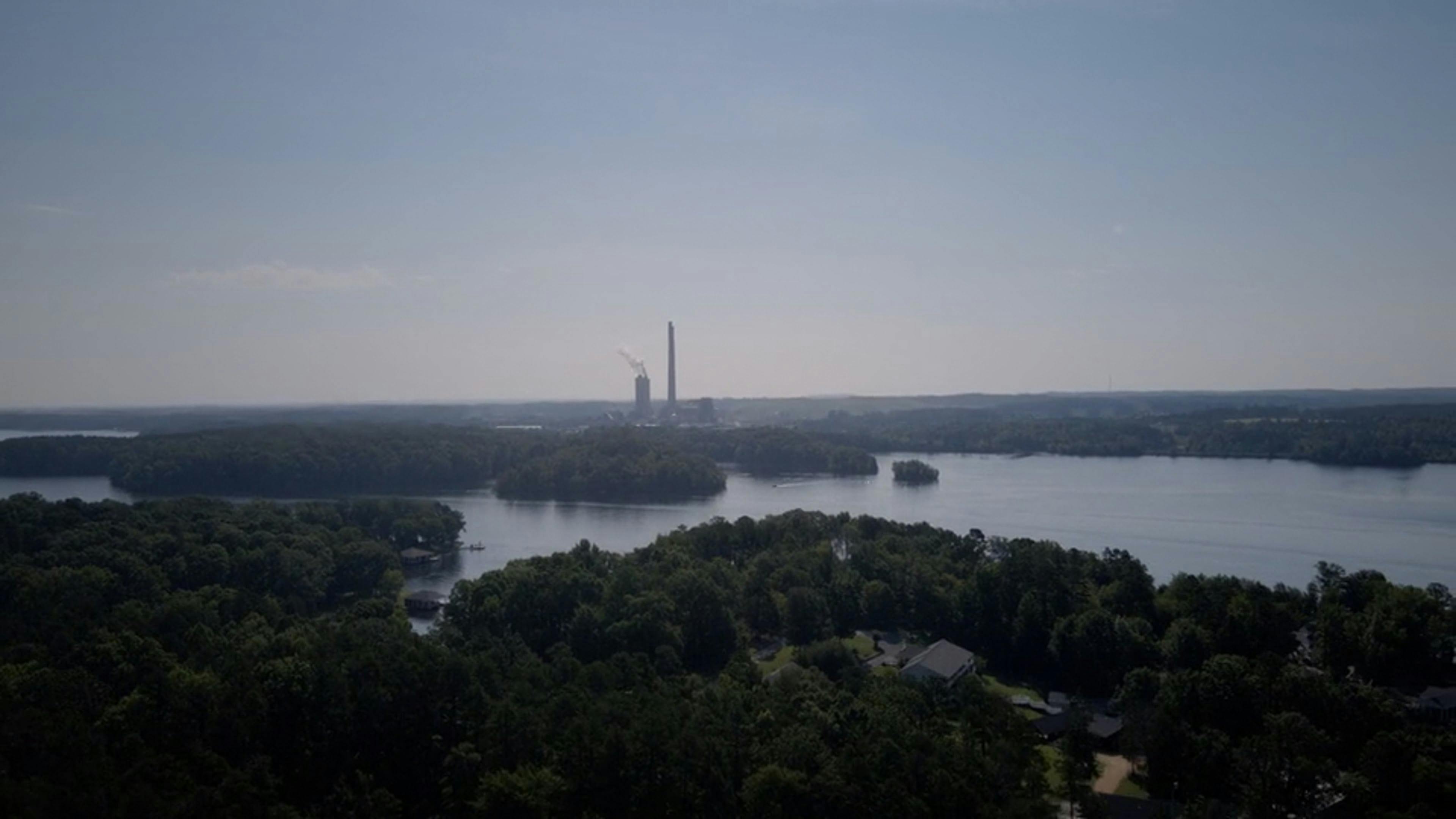 Drone Hyperlapse of a Lake and a Distant Factory Free Stock Video ...