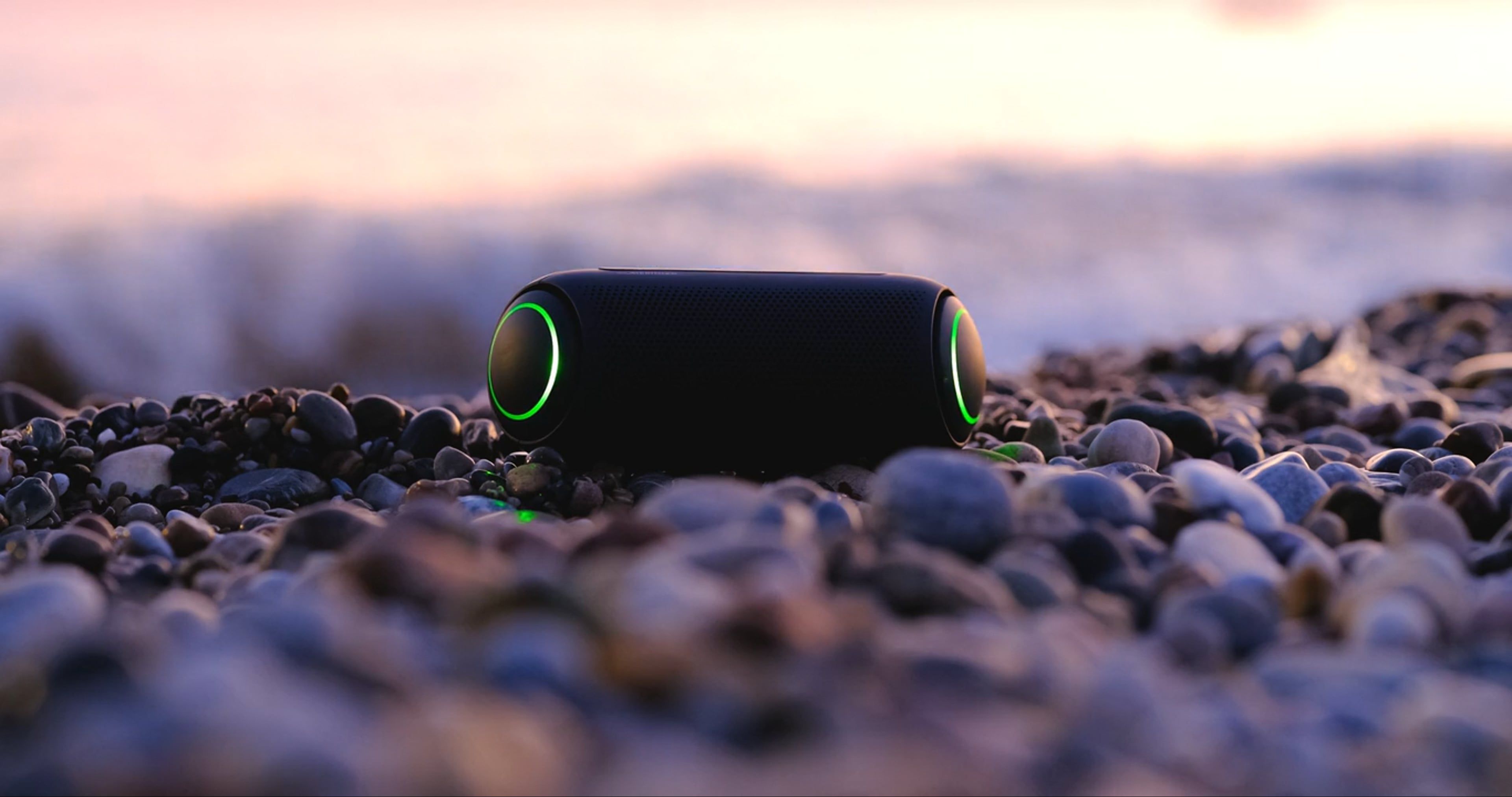 Close up of a Portable Speaker on a Pebble Beach Free Stock Video ...