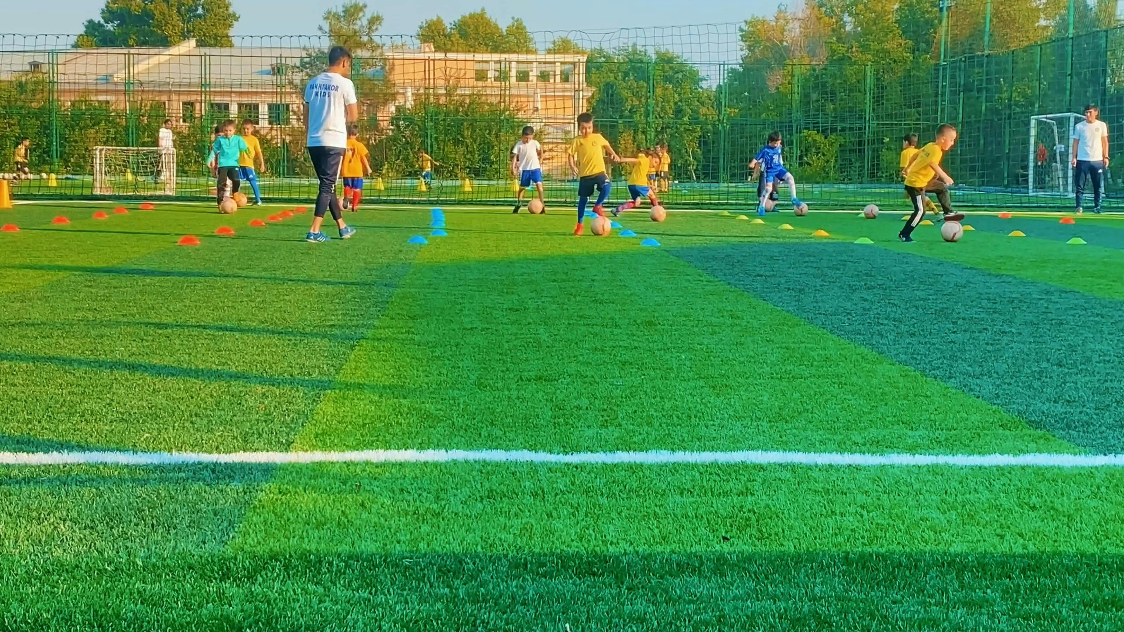 Drone Footage of Children Practising Football in a Stadium Free Stock ...