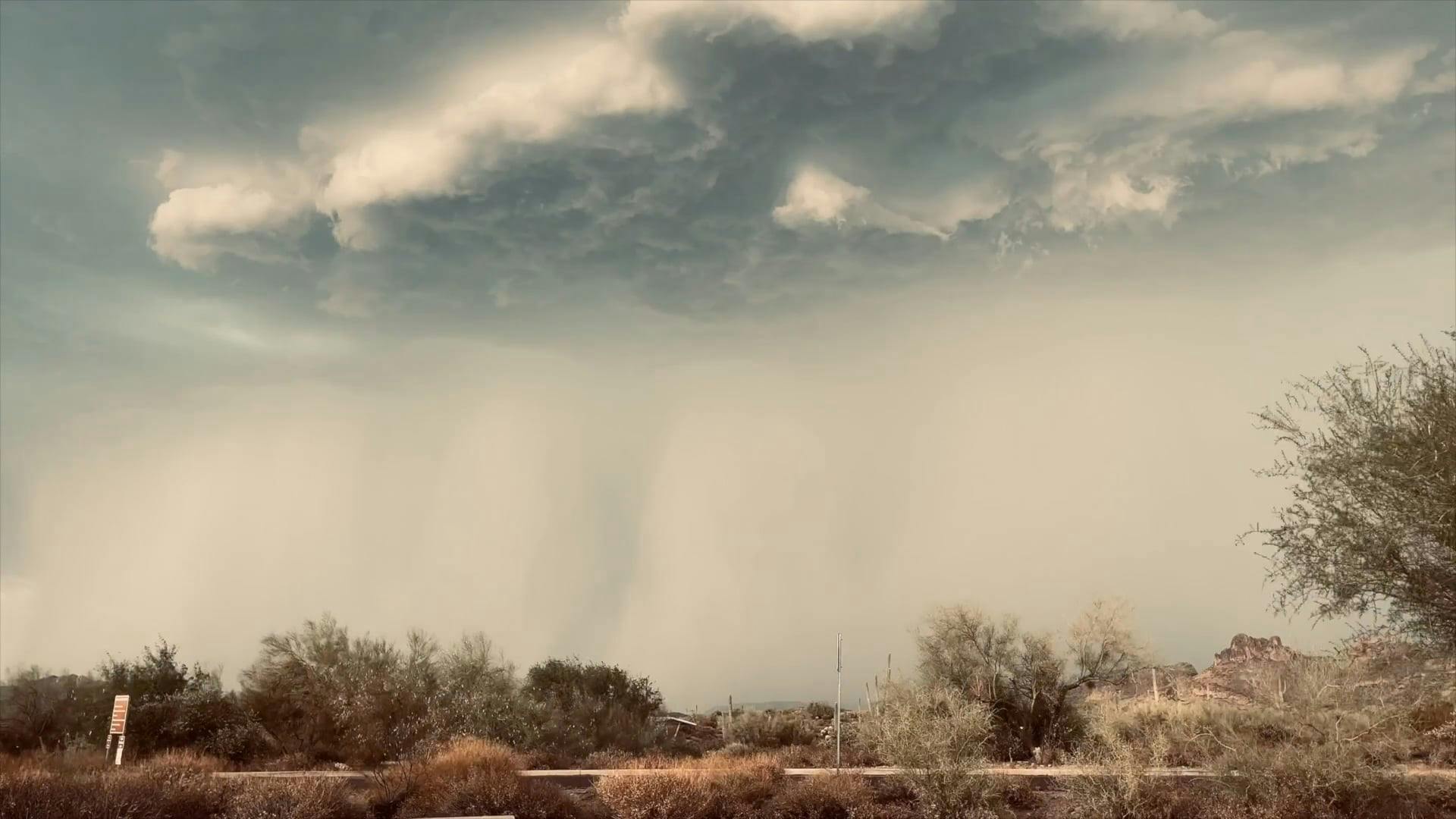 Storm Clouds over a Road in an Arid Landscape Free Stock Video Footage ...