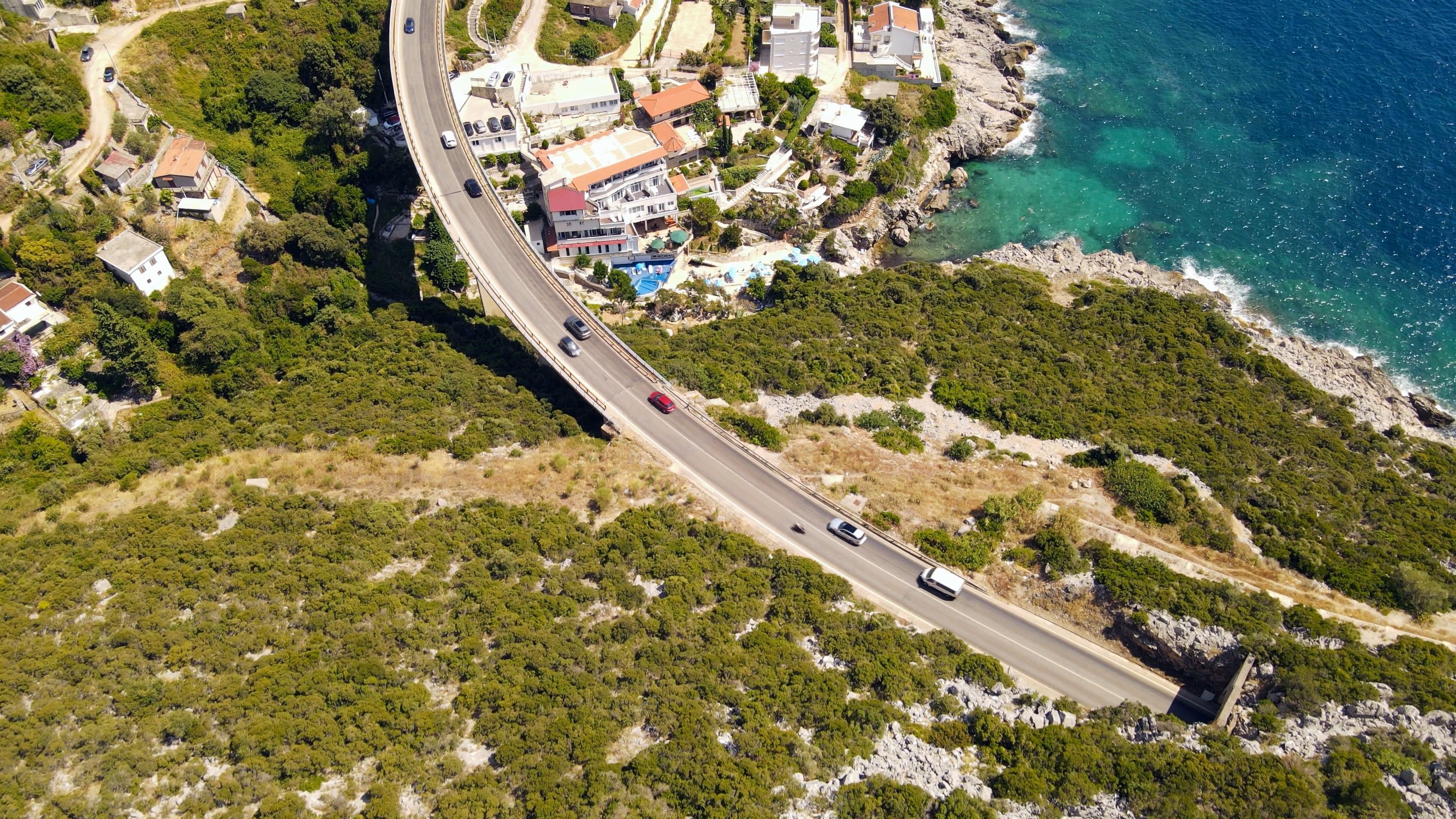 Aerial View of a Road and a Town by the Sea Free Stock Video Footage ...