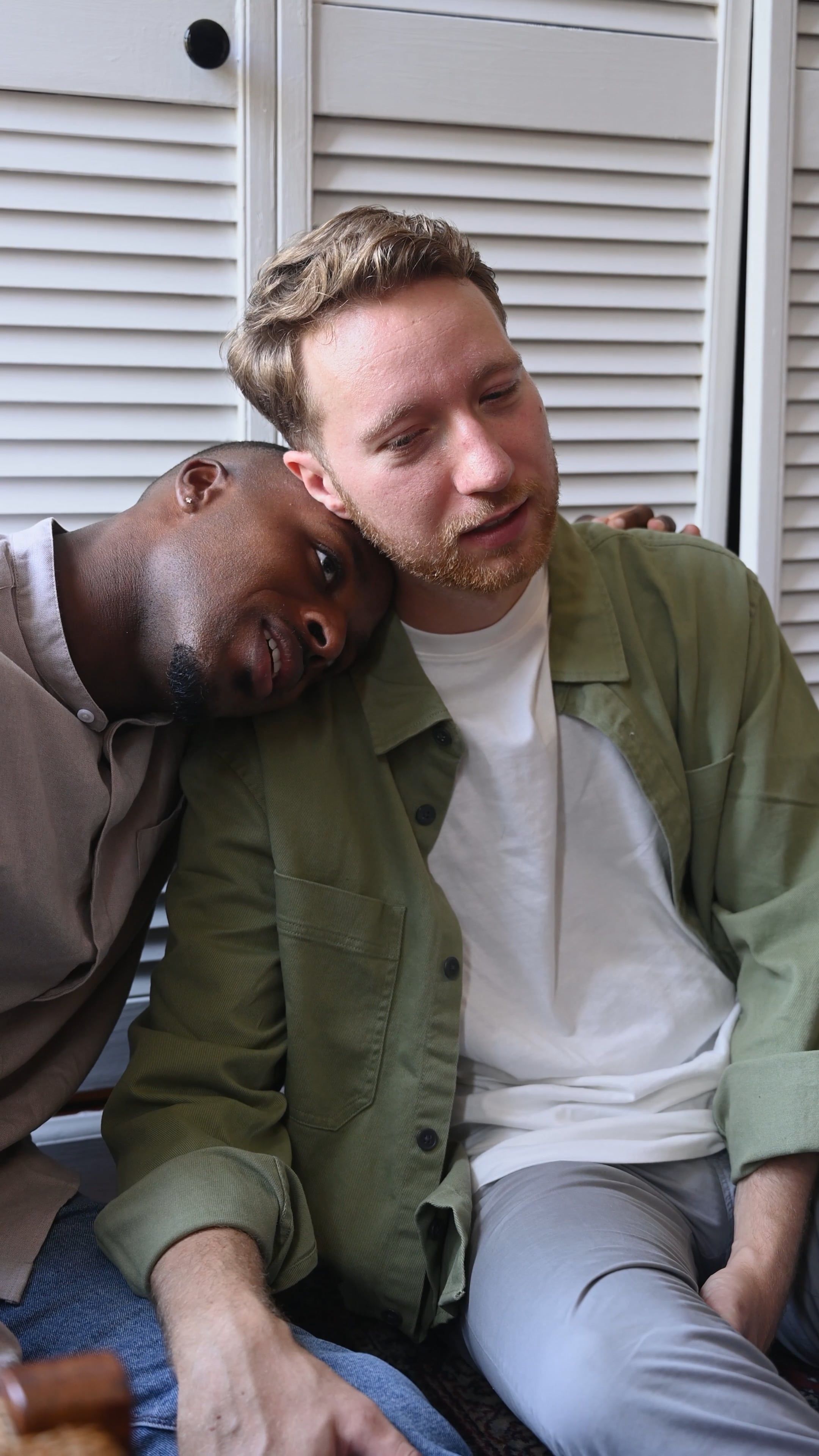 An Affectionate Couple Talking while Leaning on Each Other Free Stock ...