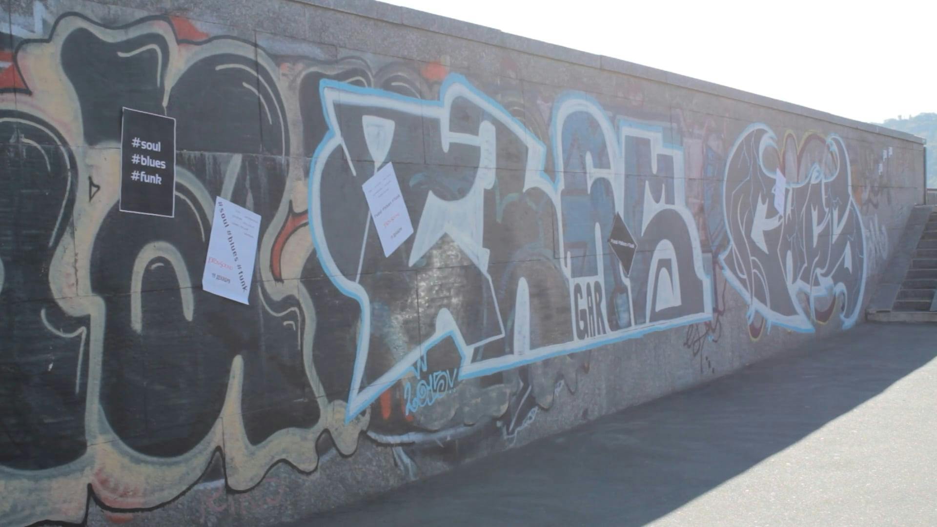 A Runner Passing by a Wall with Graffiti Art Free Stock Video Footage ...