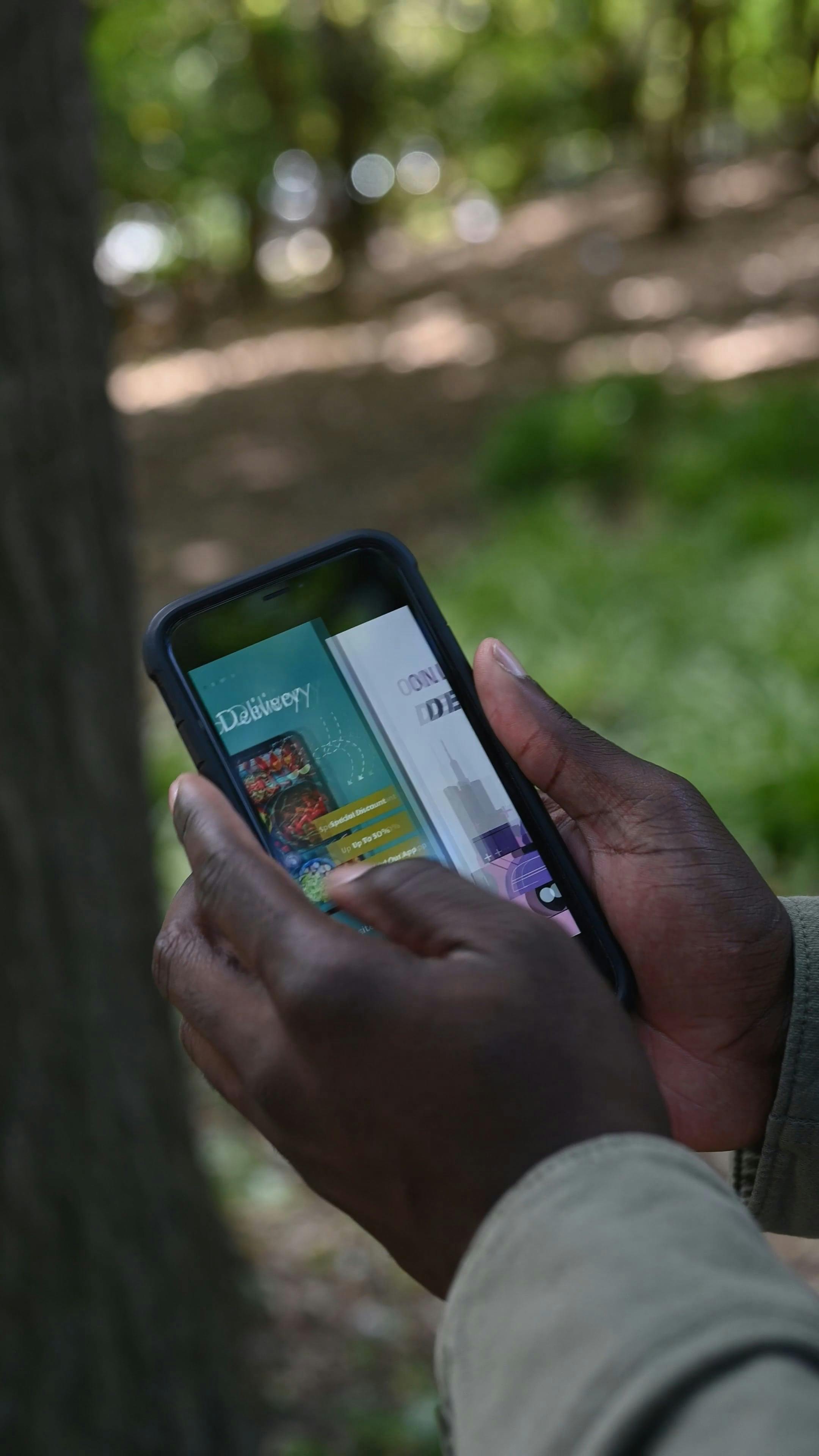 A Person Scrolling through the App Store on a Mobile Phone Free Stock ...