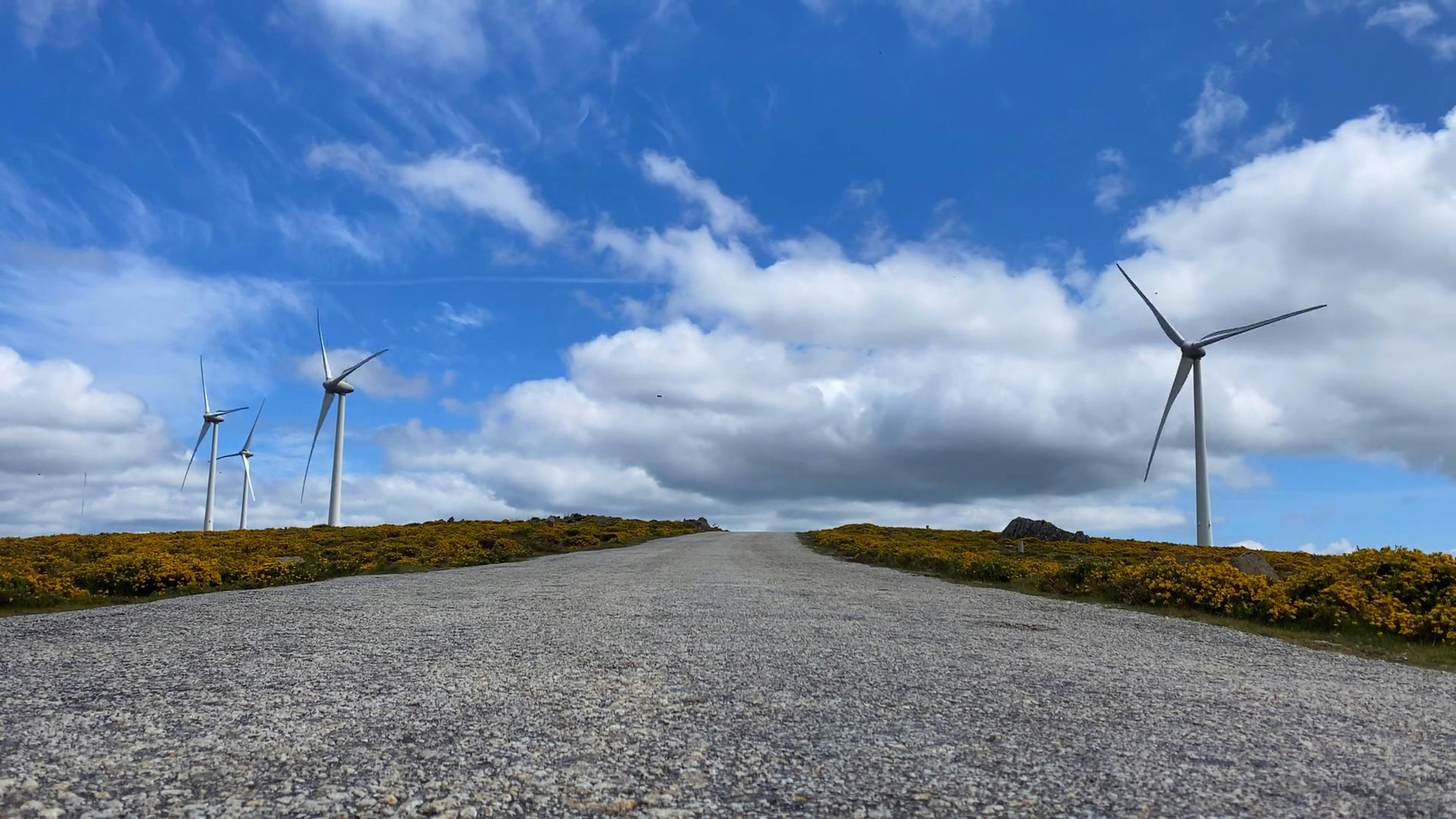 Time Lapse of Spinning Wind Turbines on the Sides of a Road Free Stock ...