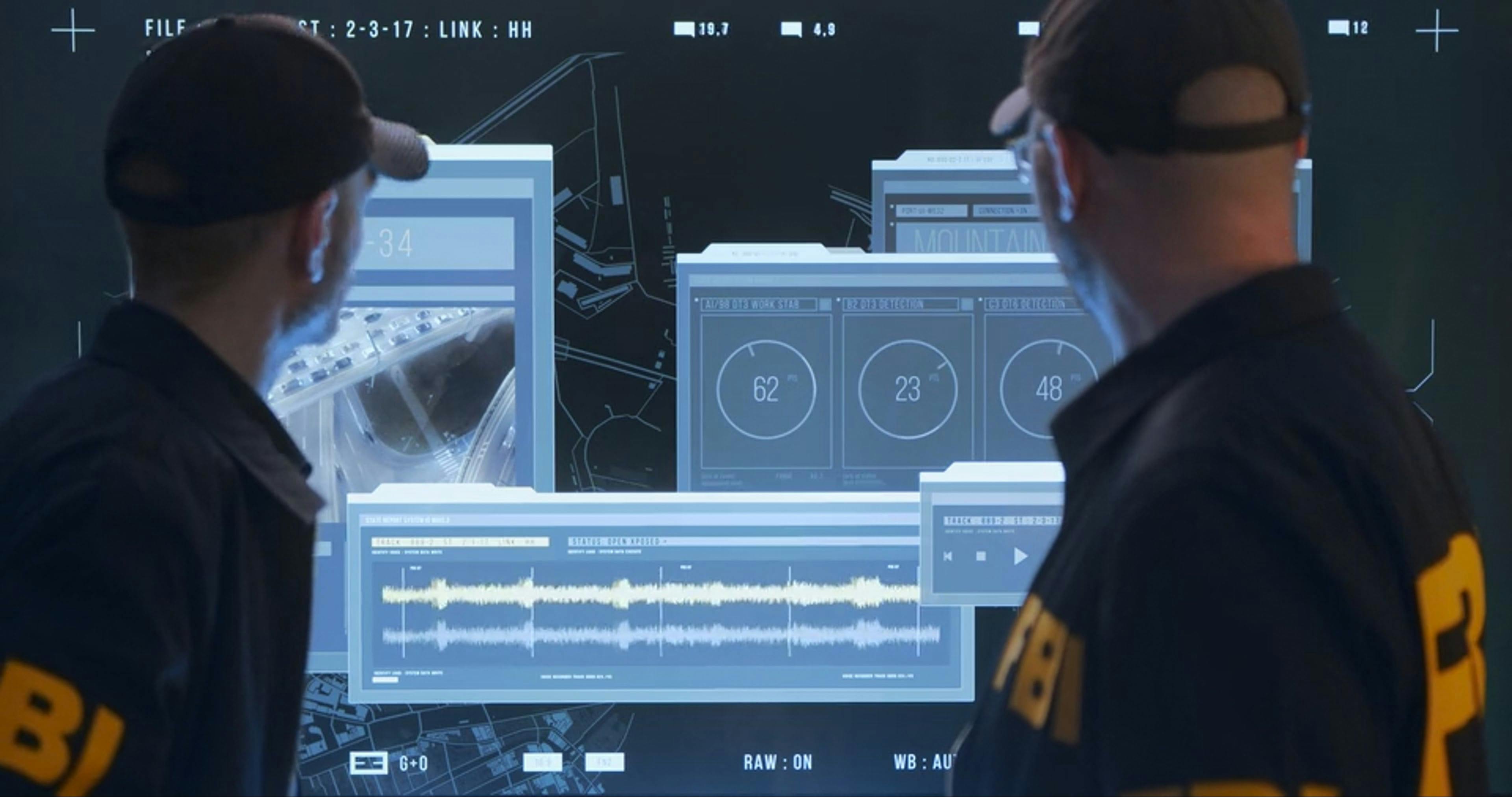 An FBI Agent Showing Photos to a Handcuffed Criminal Free Stock Video ...