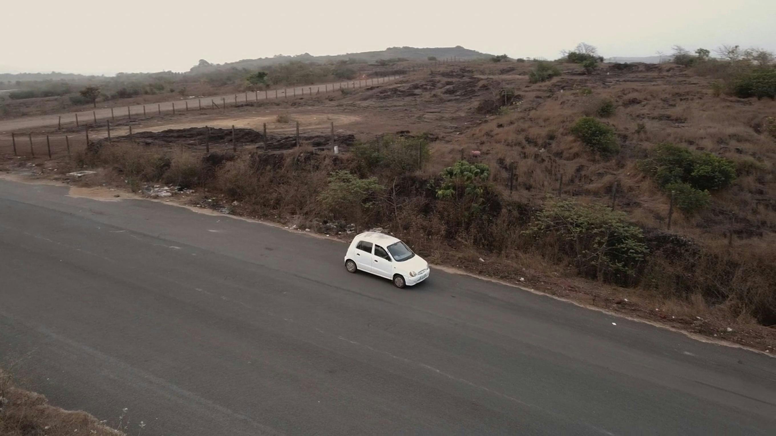A White Car Driving along an Empty Road Free Stock Video Footage ...