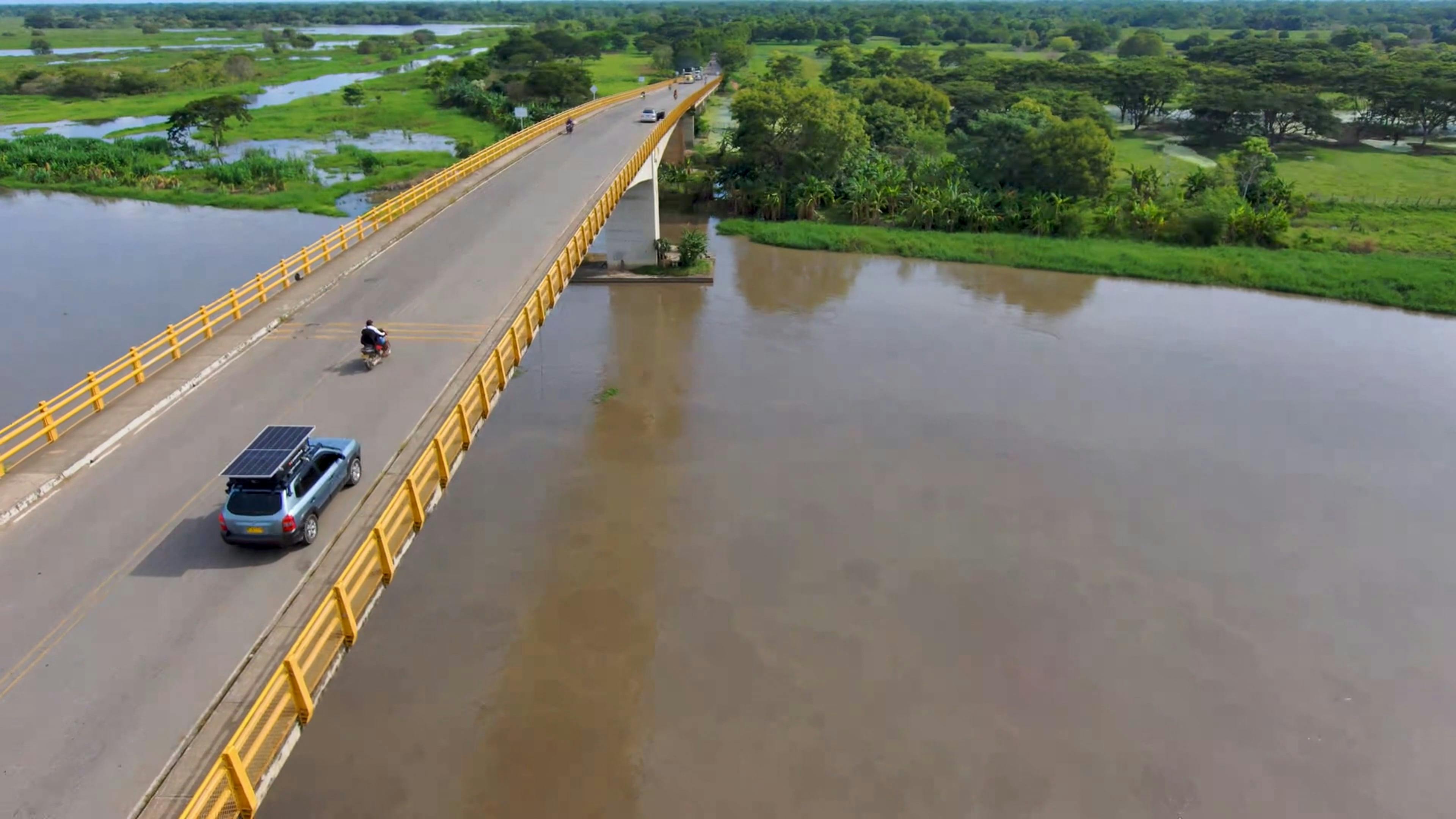 Drone Footage of Cars Crossing a Bridge Over the River Free Stock Video ...
