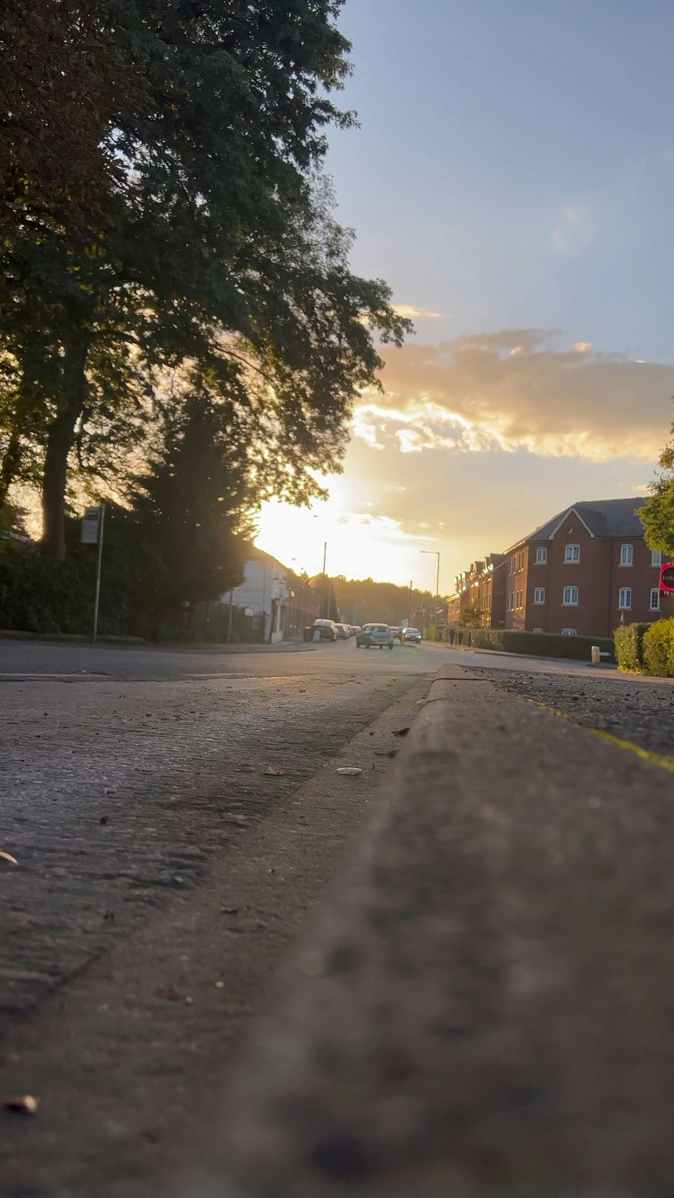 Curb View of Traffic Along a City Street at Sunset Free Stock Video ...