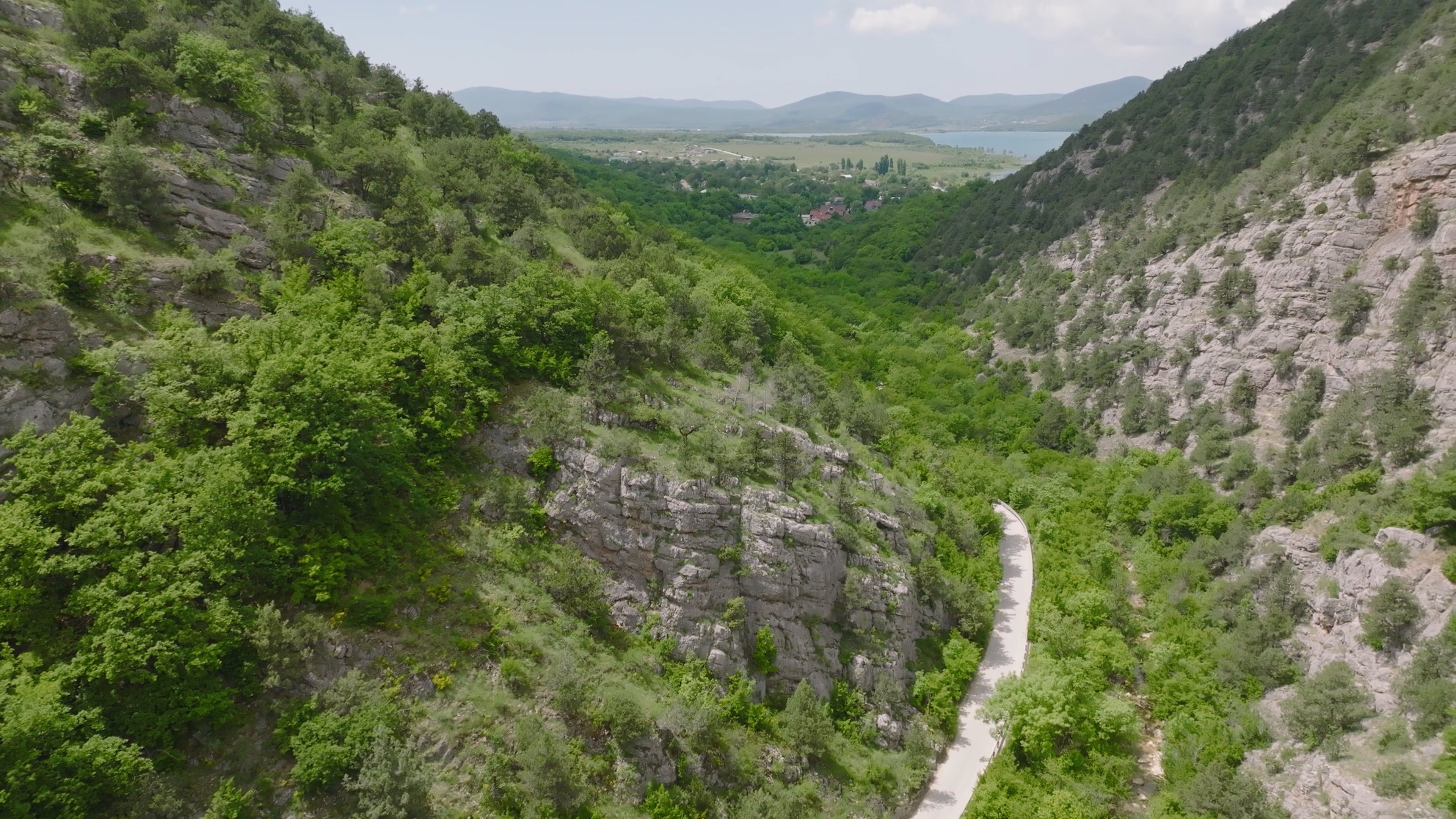 Aerial Footage of Road Between Hills and Mountains Free Stock Video ...