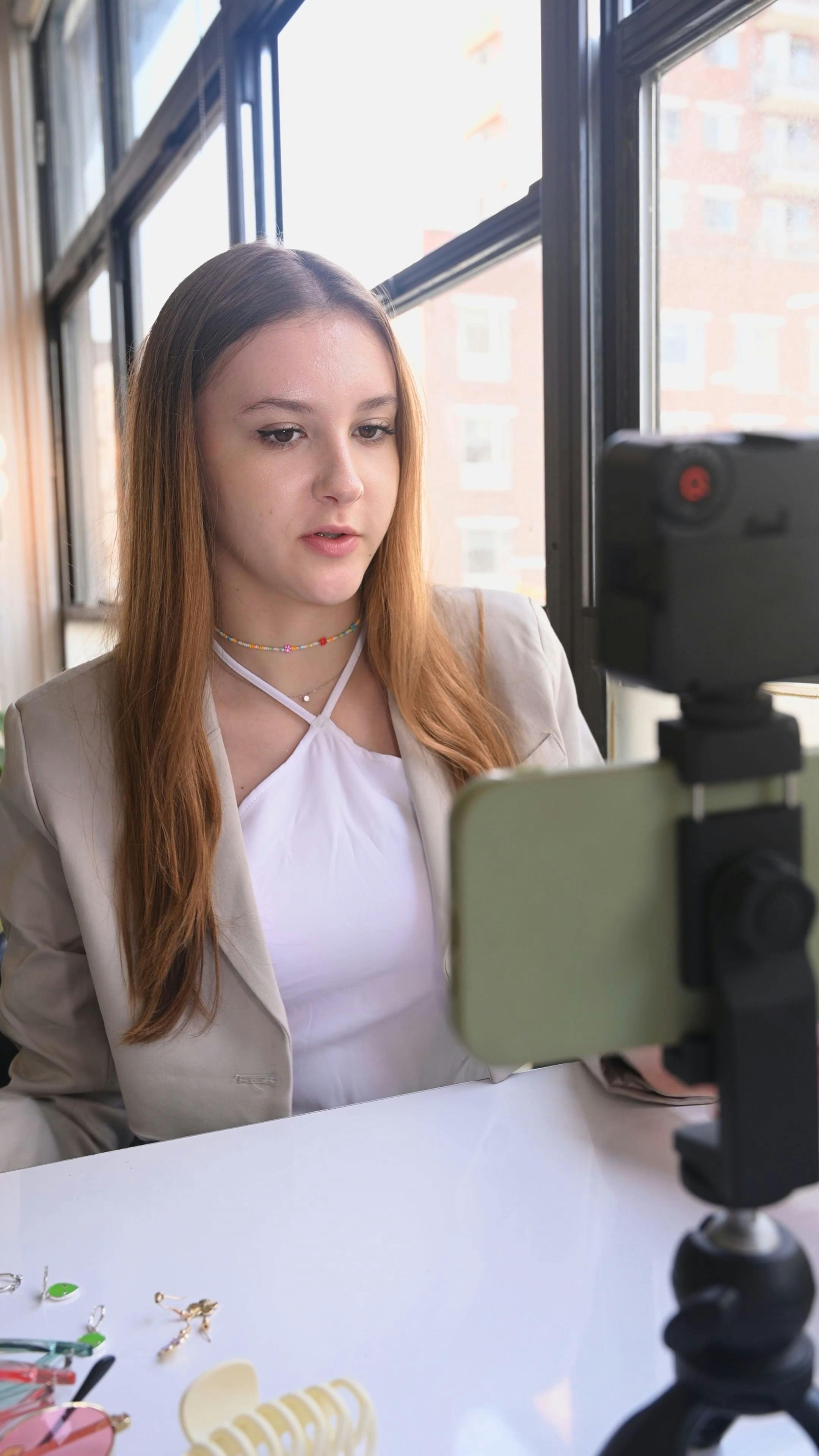 A Woman Drinking Coffee While Vlogging Free Stock Video Footage ...