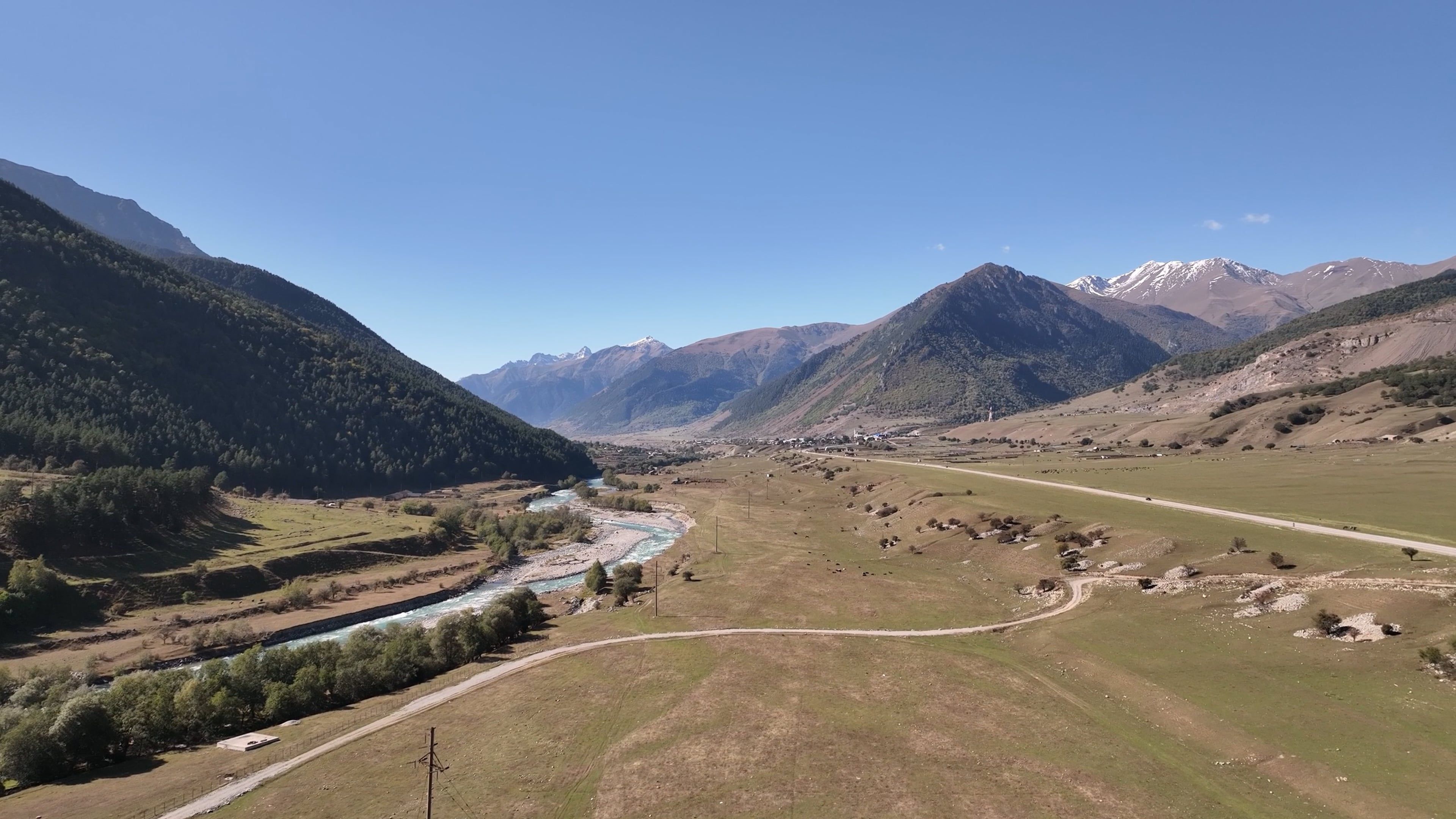 Drone Footage of a River and a Road in a Mountain Landscape Free Stock ...