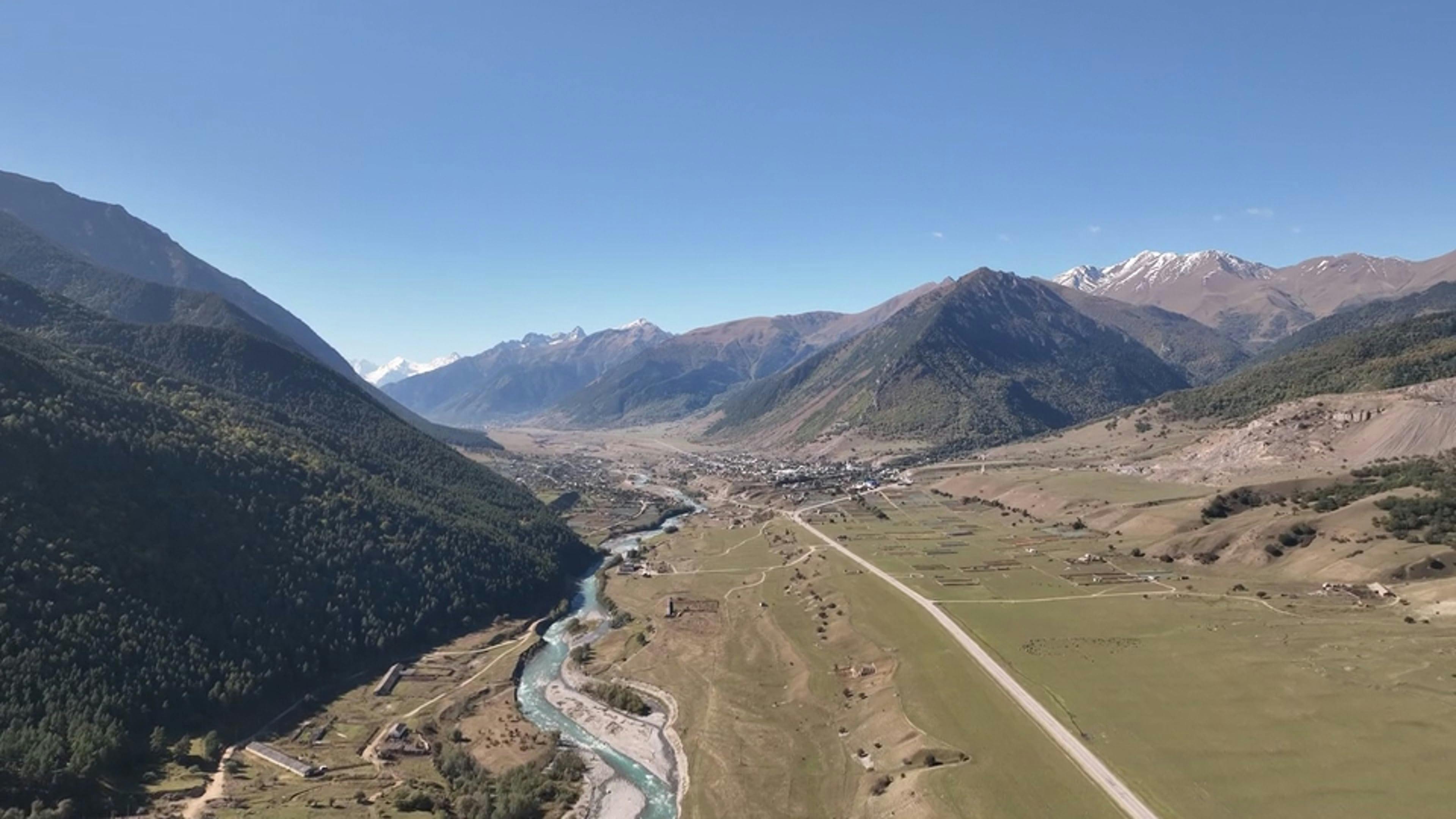 Aerial View of a Village in a Mountain Valley Free Stock Video Footage ...