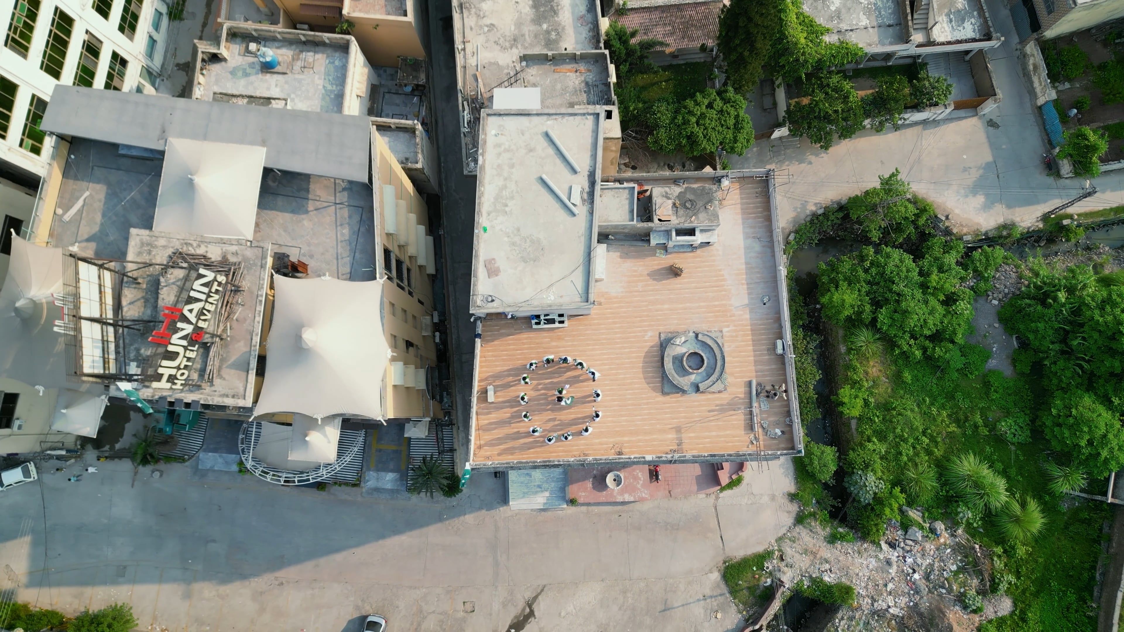 Aerial View of a Group of People Holding Pakistani Flags on a Terrace ...