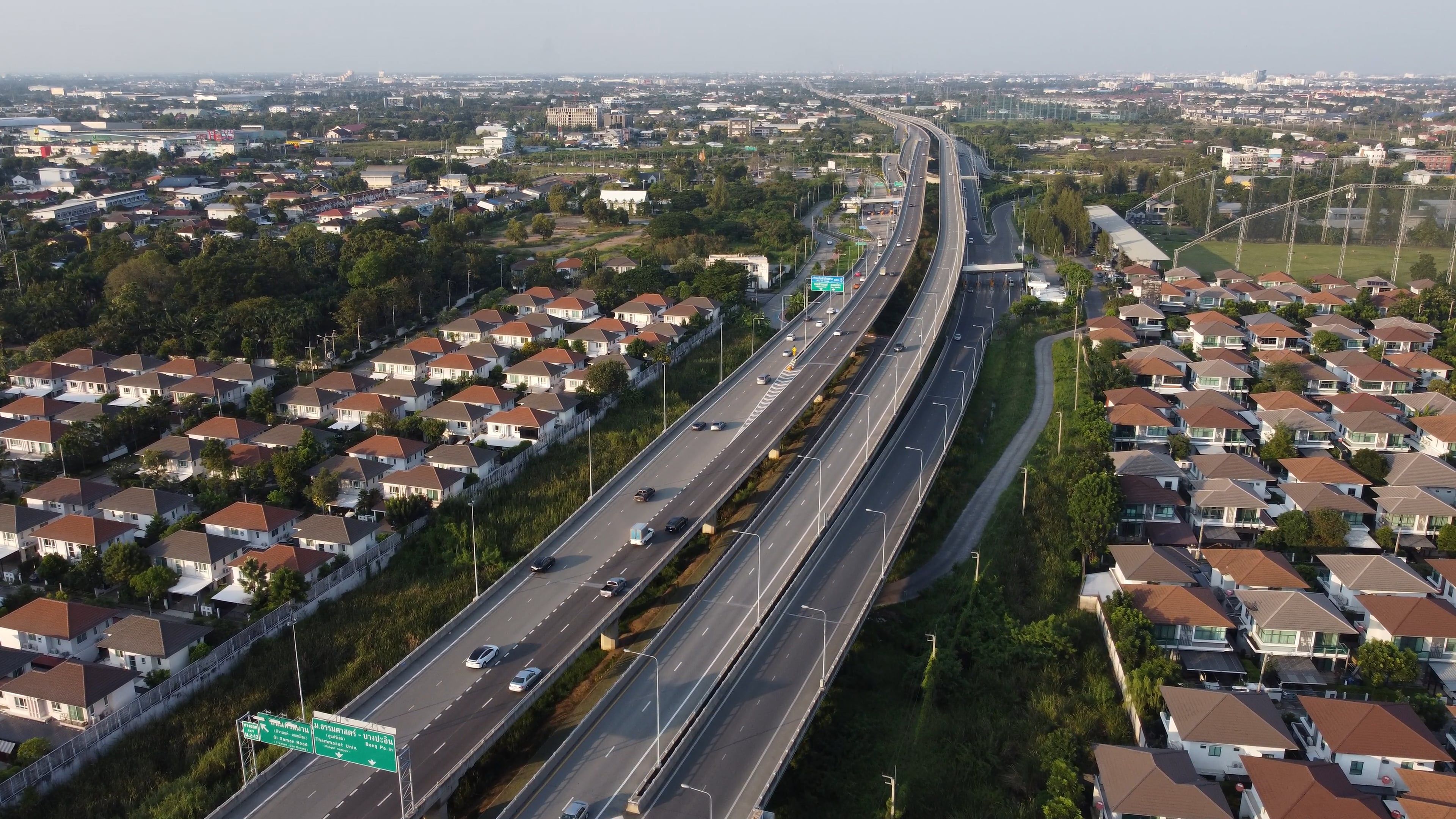 Drone Footage of Vehicles Driving along Highways in a Suburban Area ...