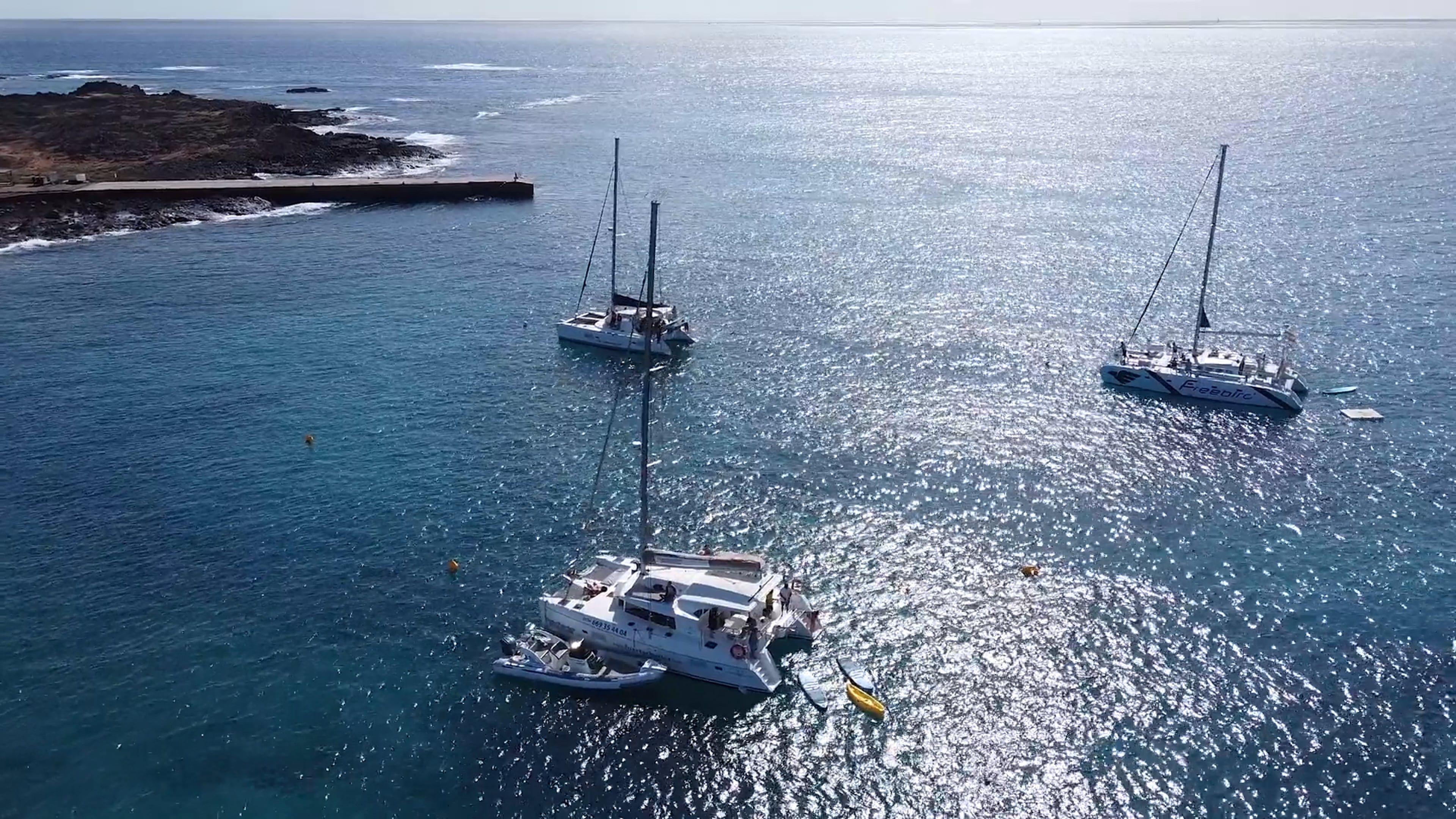 Drone Footage of Three Catamarans Sailing near the Coast Free Stock ...