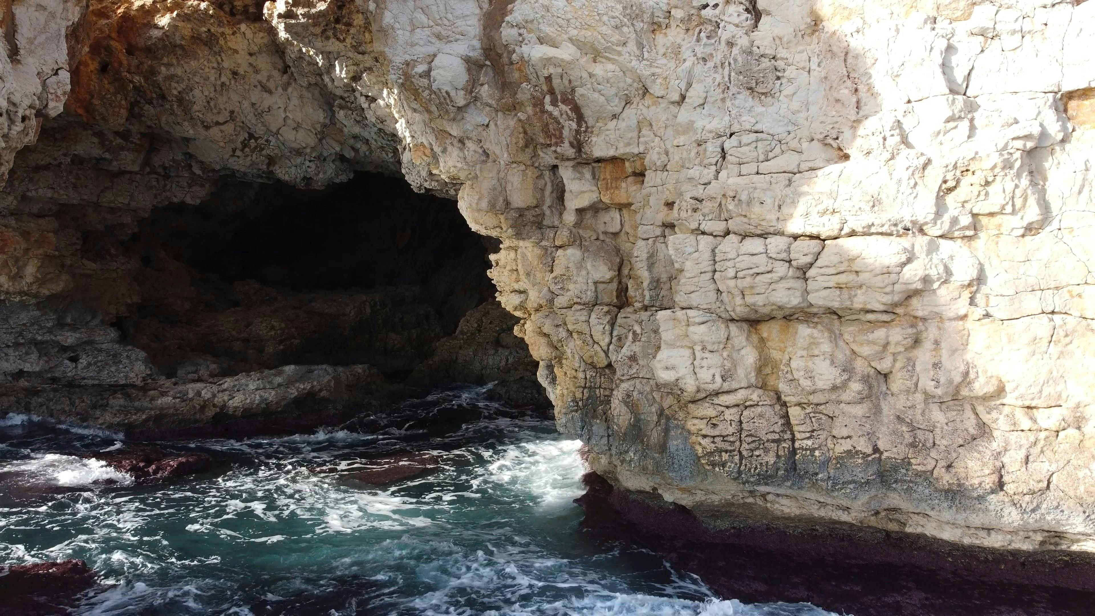 A Large Cave On A Cliff Of A Rocky Mountain Free Stock Video Footage ...