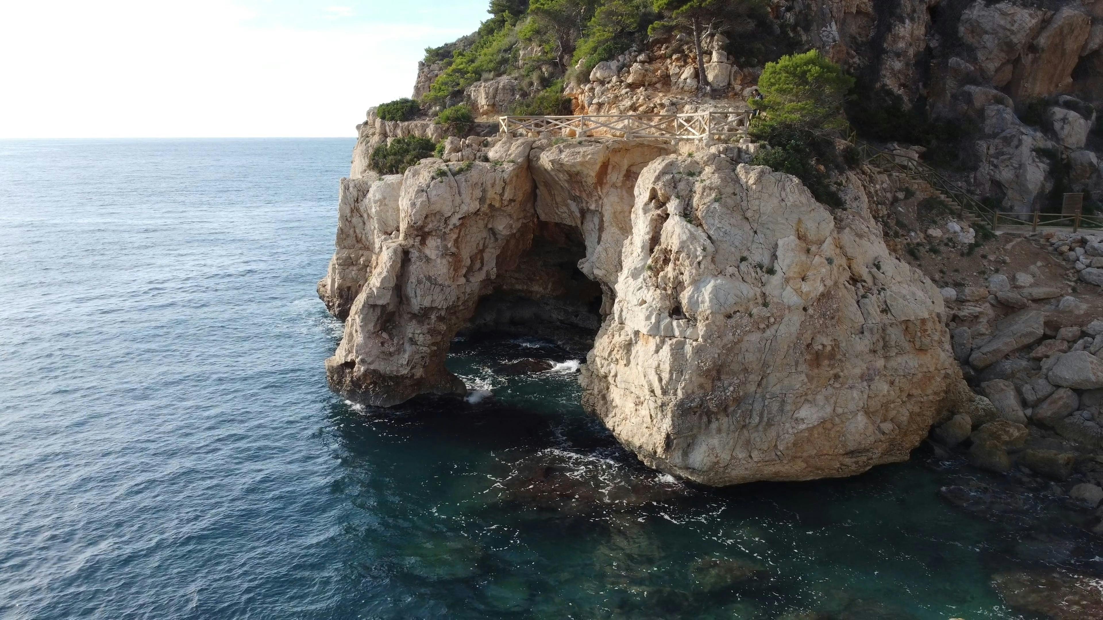 Drone Footage of Natural Caves on the Cliffed Coast of Alicante, Spain ...