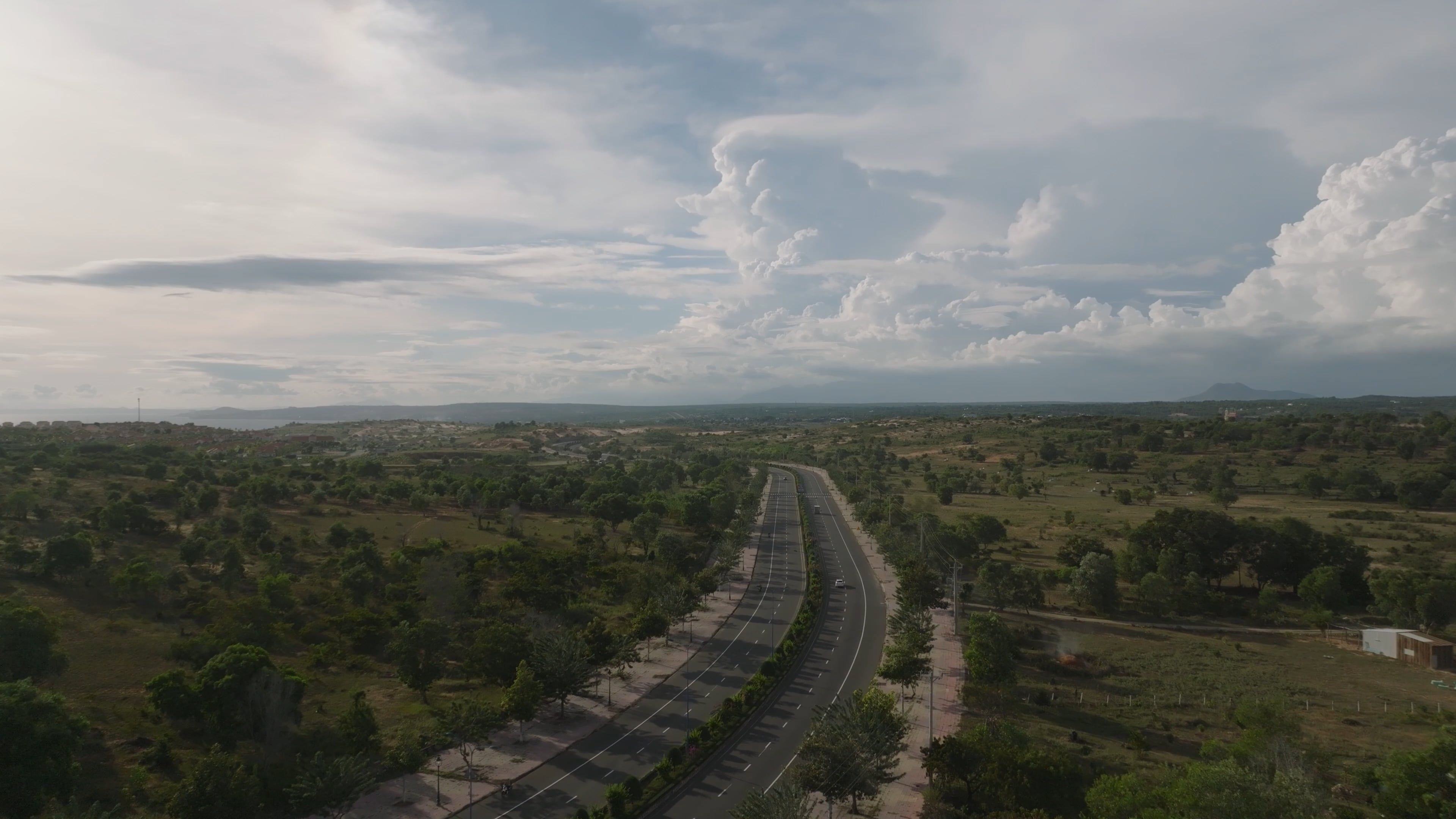 A Drone Footage of Moving Cars on the Road Between Green Trees Free ...