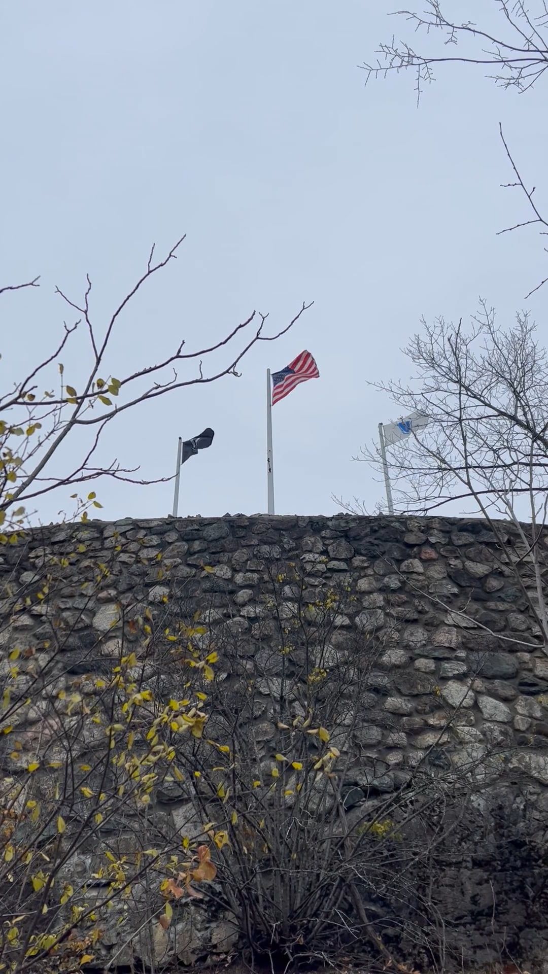 Low Angle View of Flags Waving on Top of a Stone Wall Free Stock Video ...