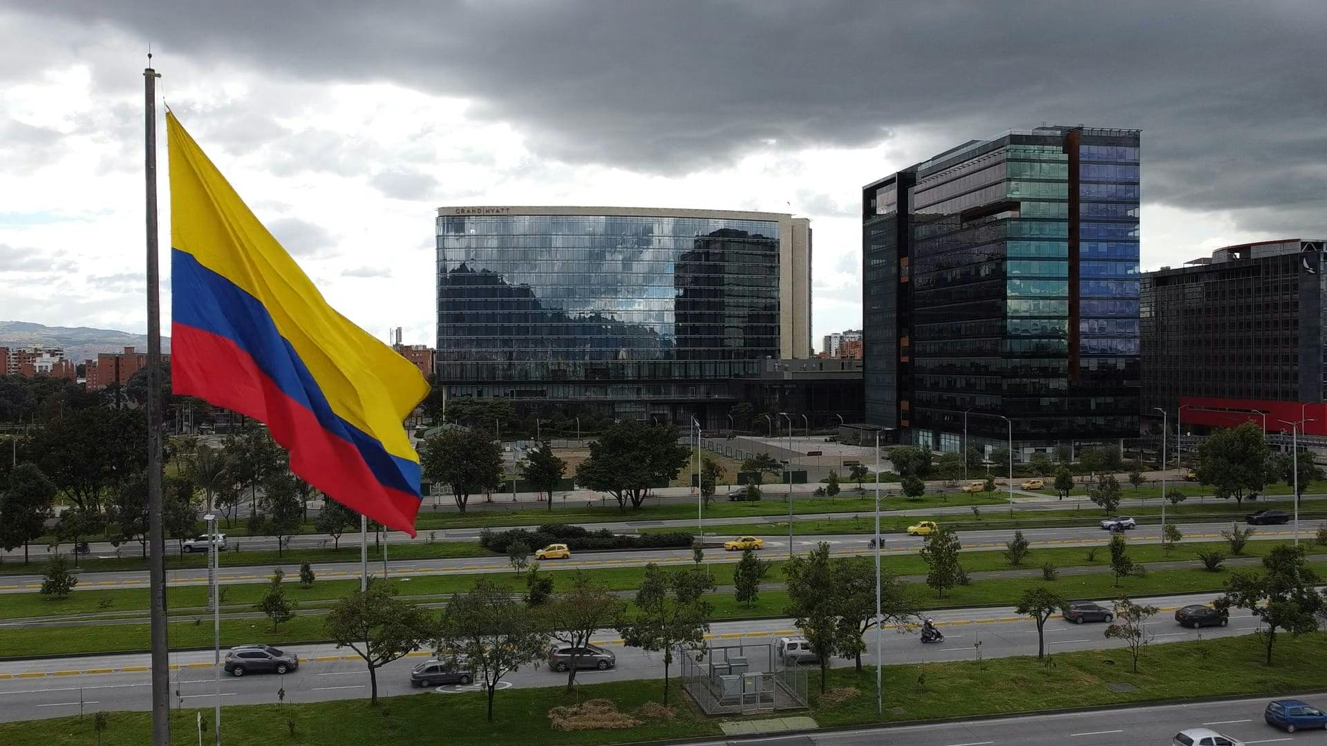 The Colombian National Flag Waving on a Pole in the City of Bogotá Free ...