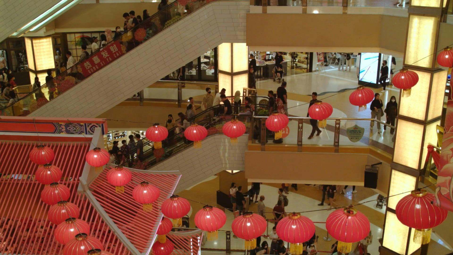 A Crowded Shopping Mall Decorated with Red Paper Lanterns Free Stock ...