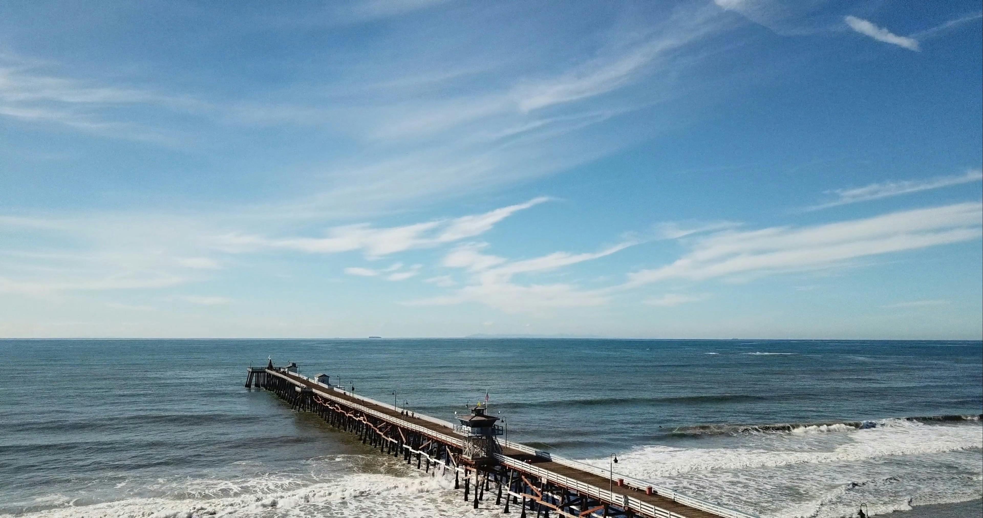 A Drone Footage of a Wooden Dock on the Beach Free Stock Video Footage ...