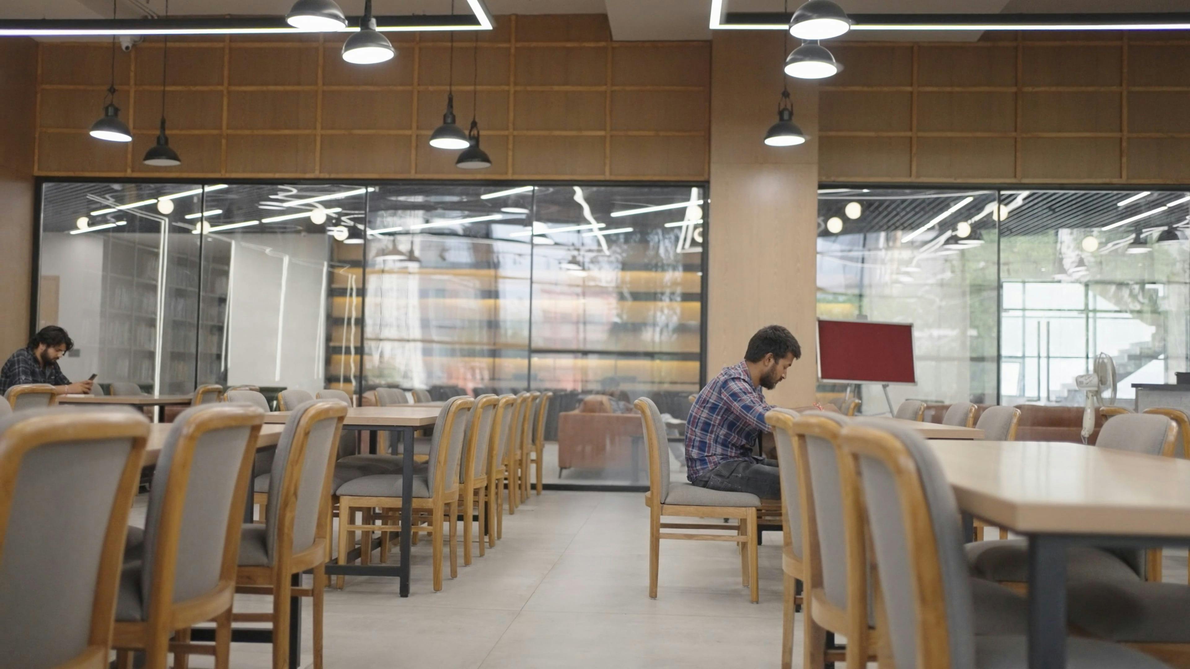 Men Sitting on the Chair Inside the Library Free Stock Video Footage ...