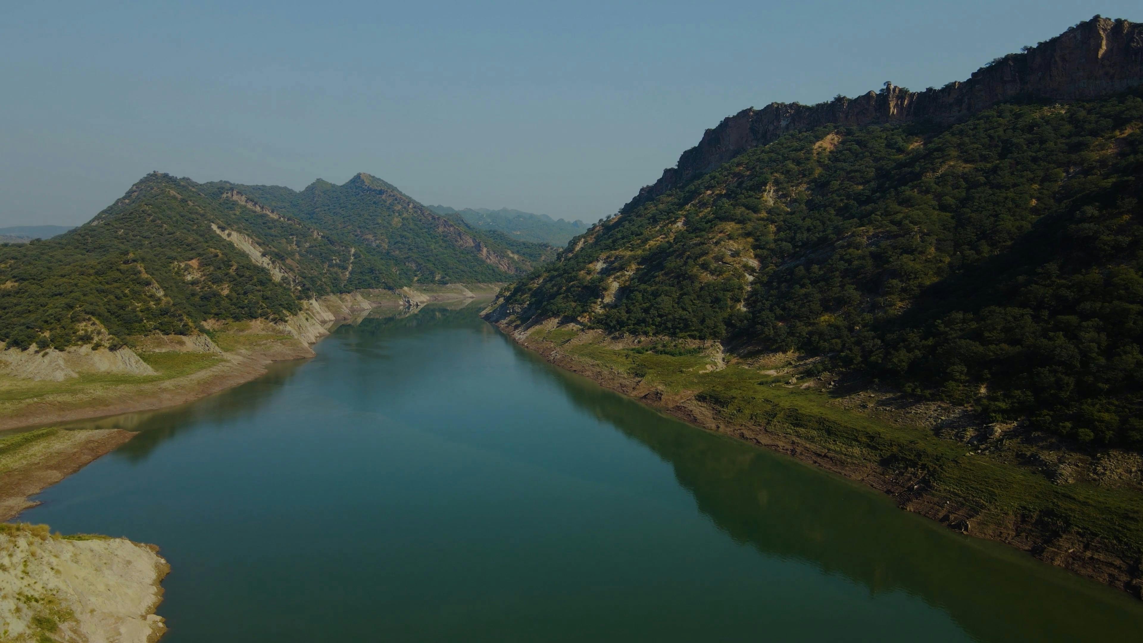 A River In Between Mountains with Green Trees Free Stock Video Footage ...