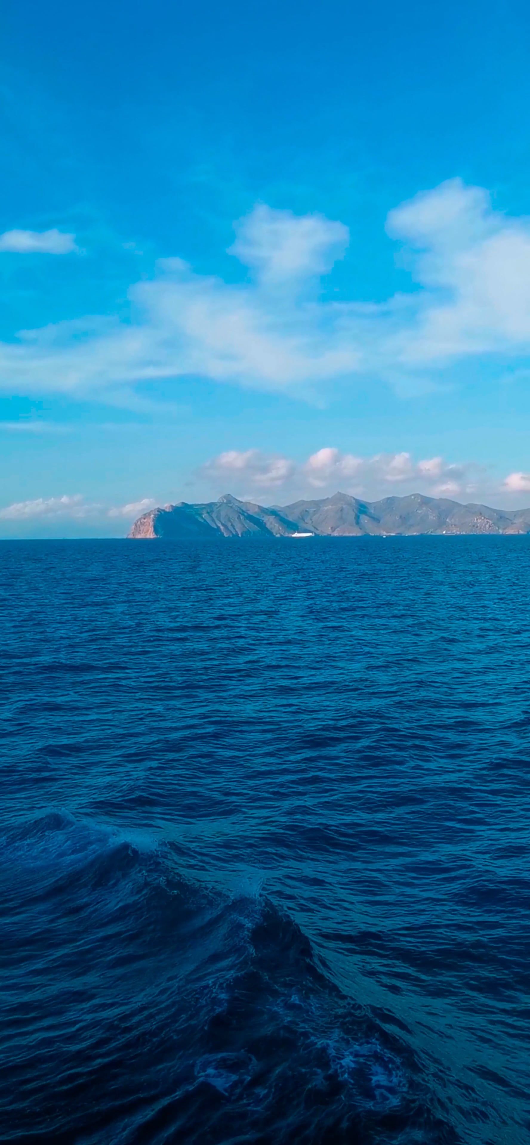 An Ocean Waves Under the Blue Sky and White Clouds Free Stock Video ...